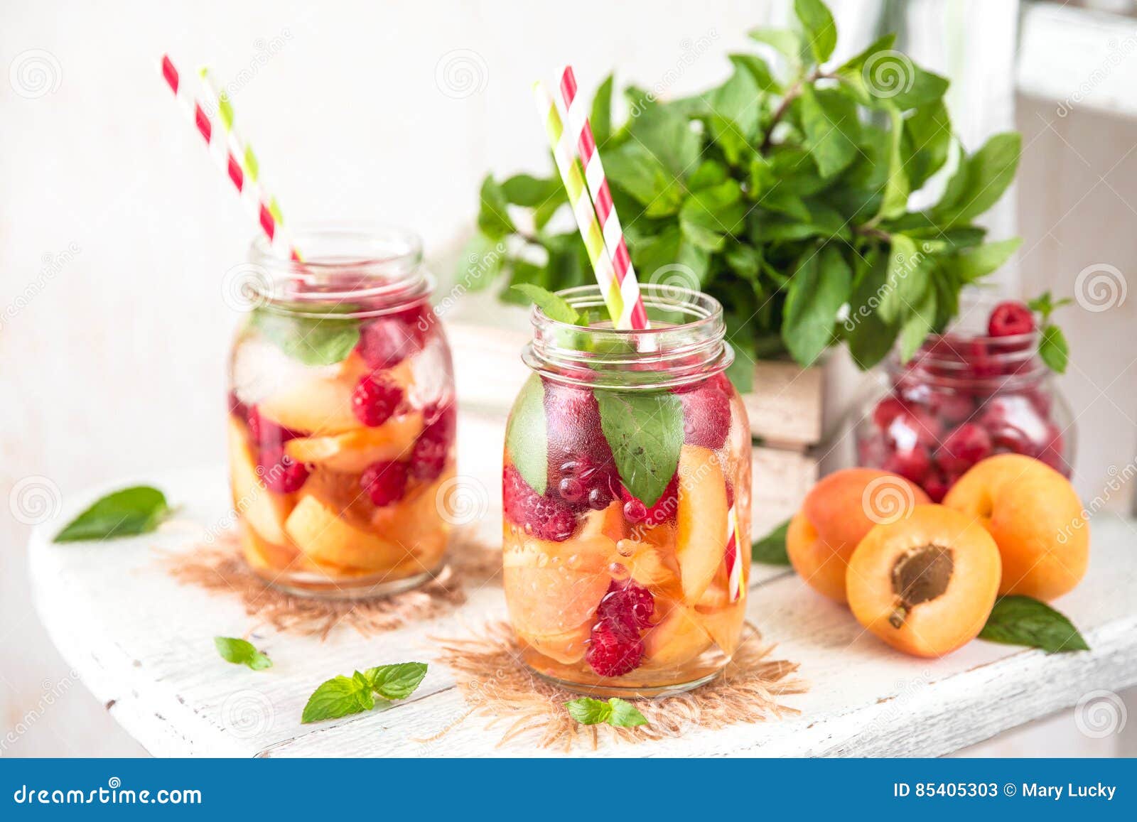 Fruit Infused Detox Water with Apricots Raspberries and Mint Stock ...