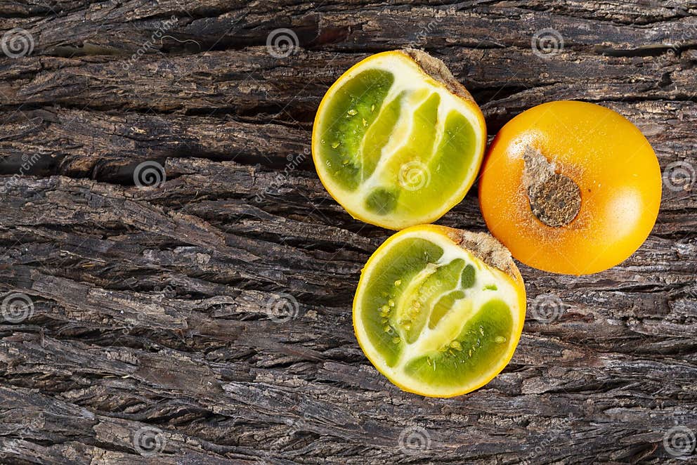 Fruit of lulo on tree bark stock image. Image of tropical - 141394463