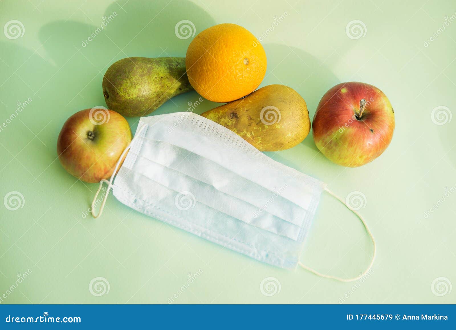 Fruit and Protective Mask on a Mint Background, Fruit Harvest ...
