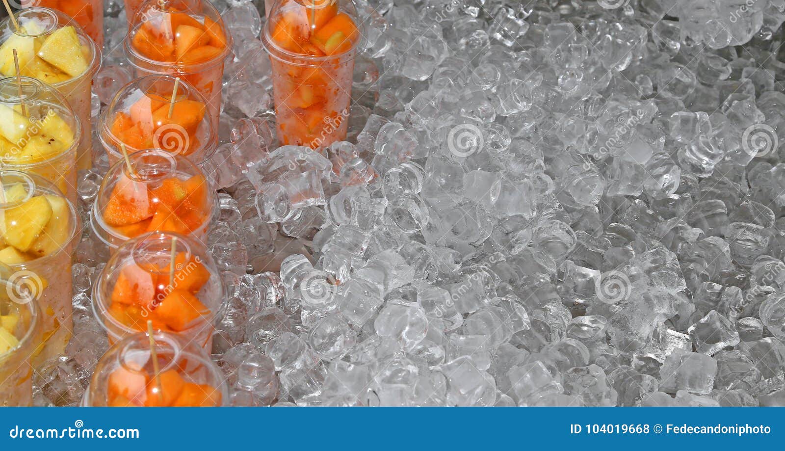 Fruit Salad with Pieces of Fruit and Ice Cubes Stock Photo - Image of ...