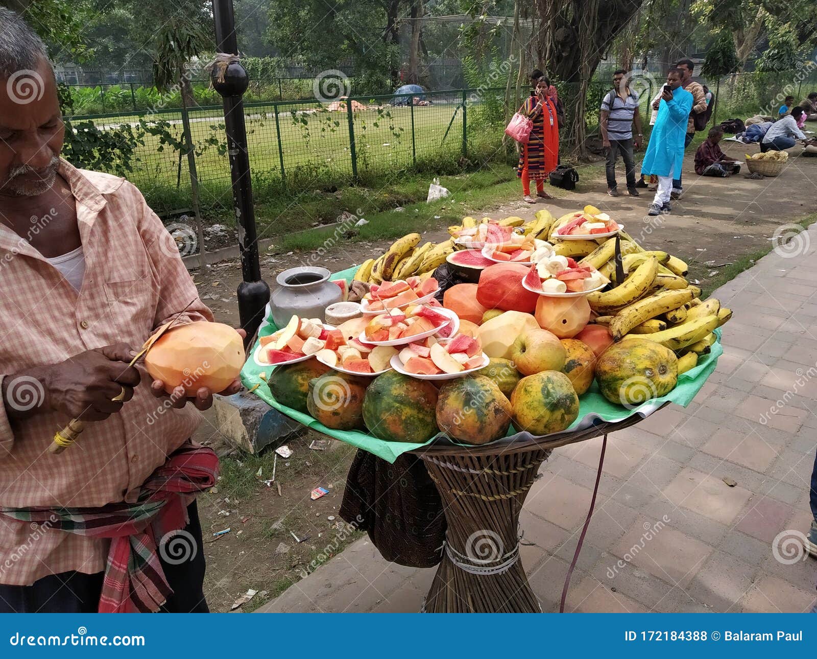 A Fruit Seller Selling Fruits in a Park Editorial Stock Photo - Image ...