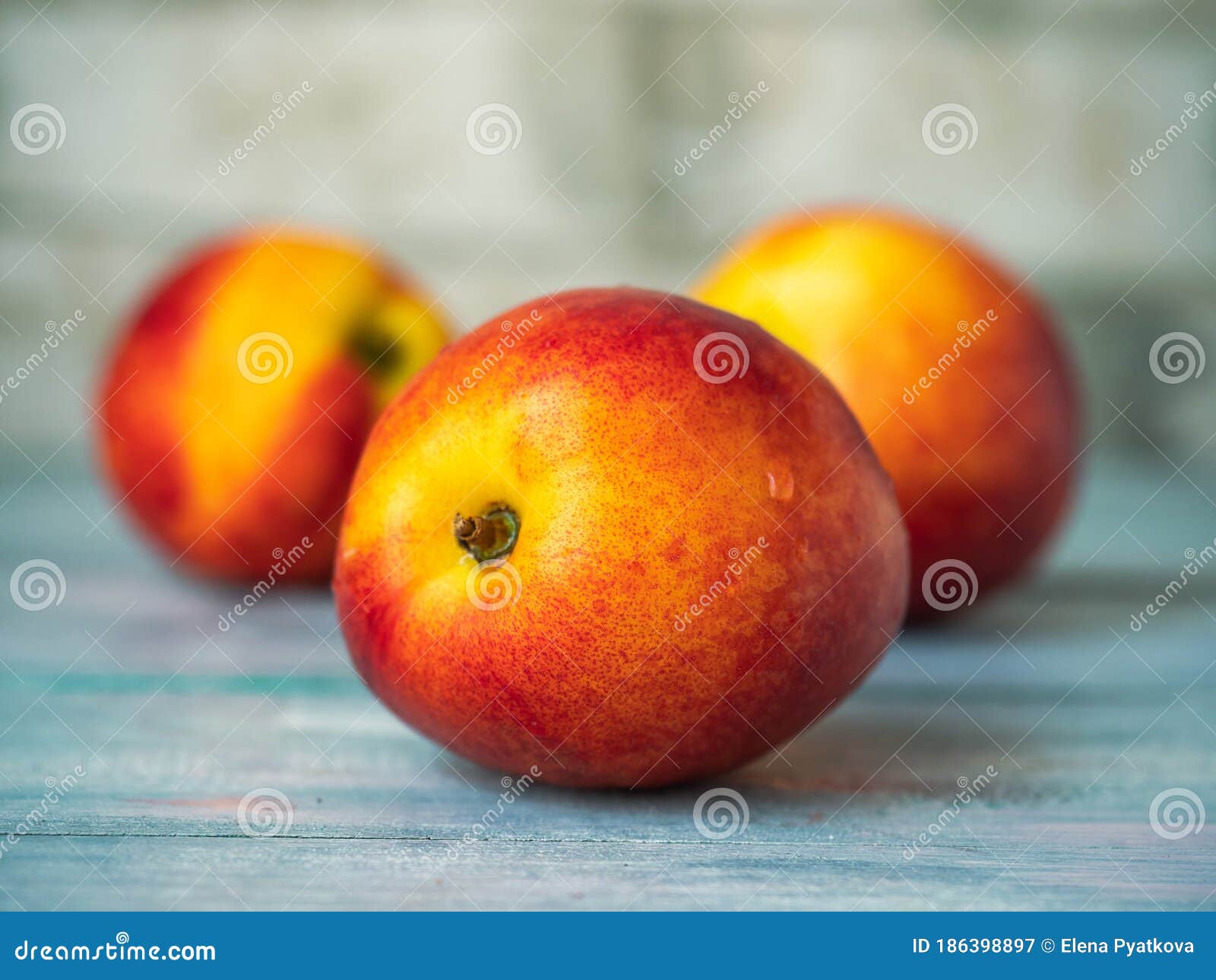 Fruit on the Table. Three Ripe Yellow Red Nectarines Stock Image ...