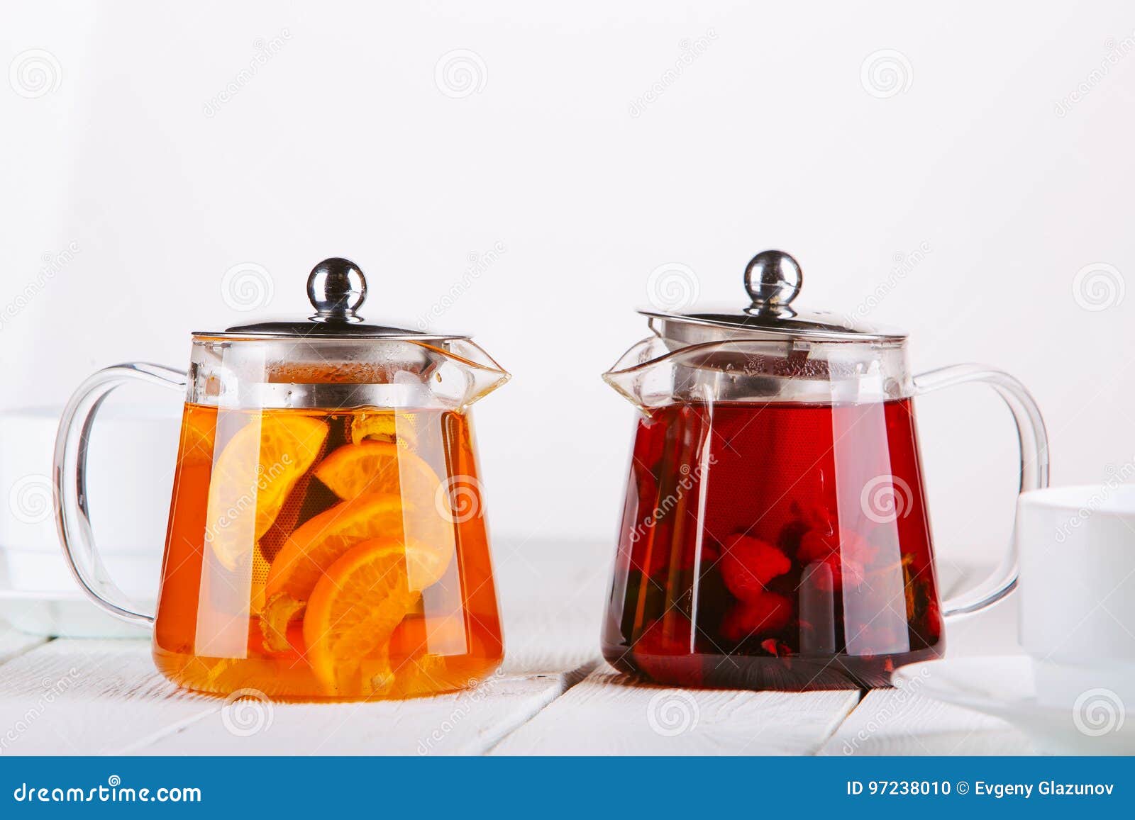 Fruit Tea in Glass Jugs or Jars with and Lemon on the Wooden Table ...