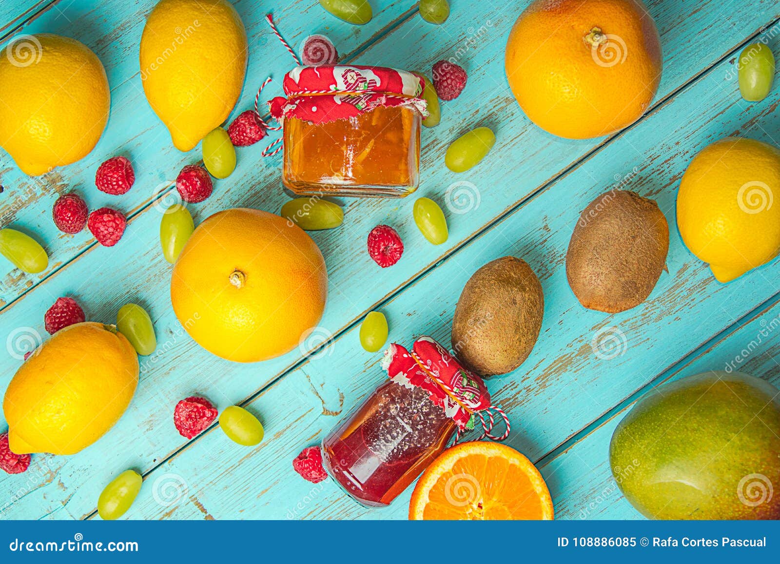 Fruits on a Light Blue Rustic Table. Grapefruit, Grapes,blackberries ...