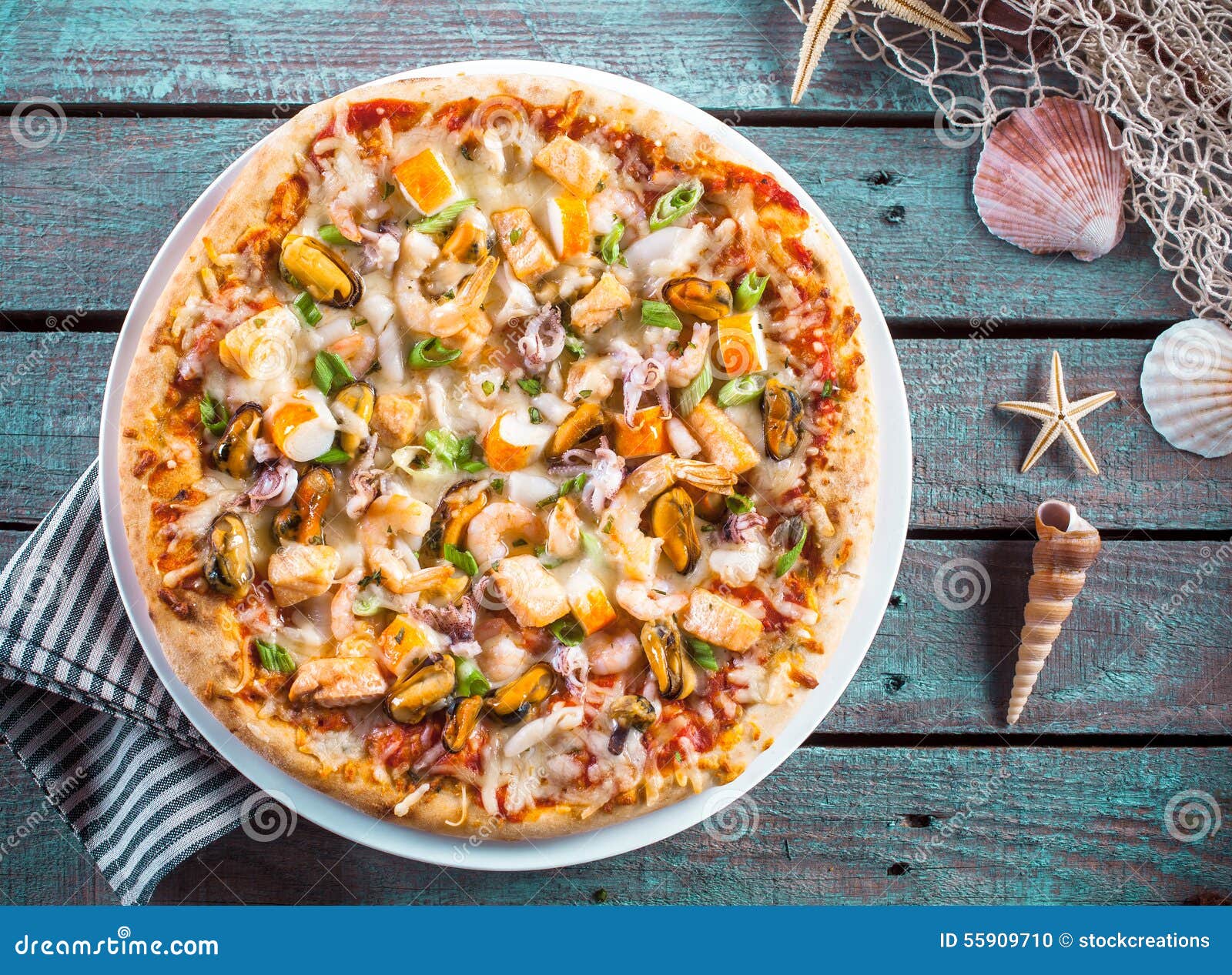 Fruits of the Sea Pizza on Rustic Wood Table with Shells Stock Photo ...