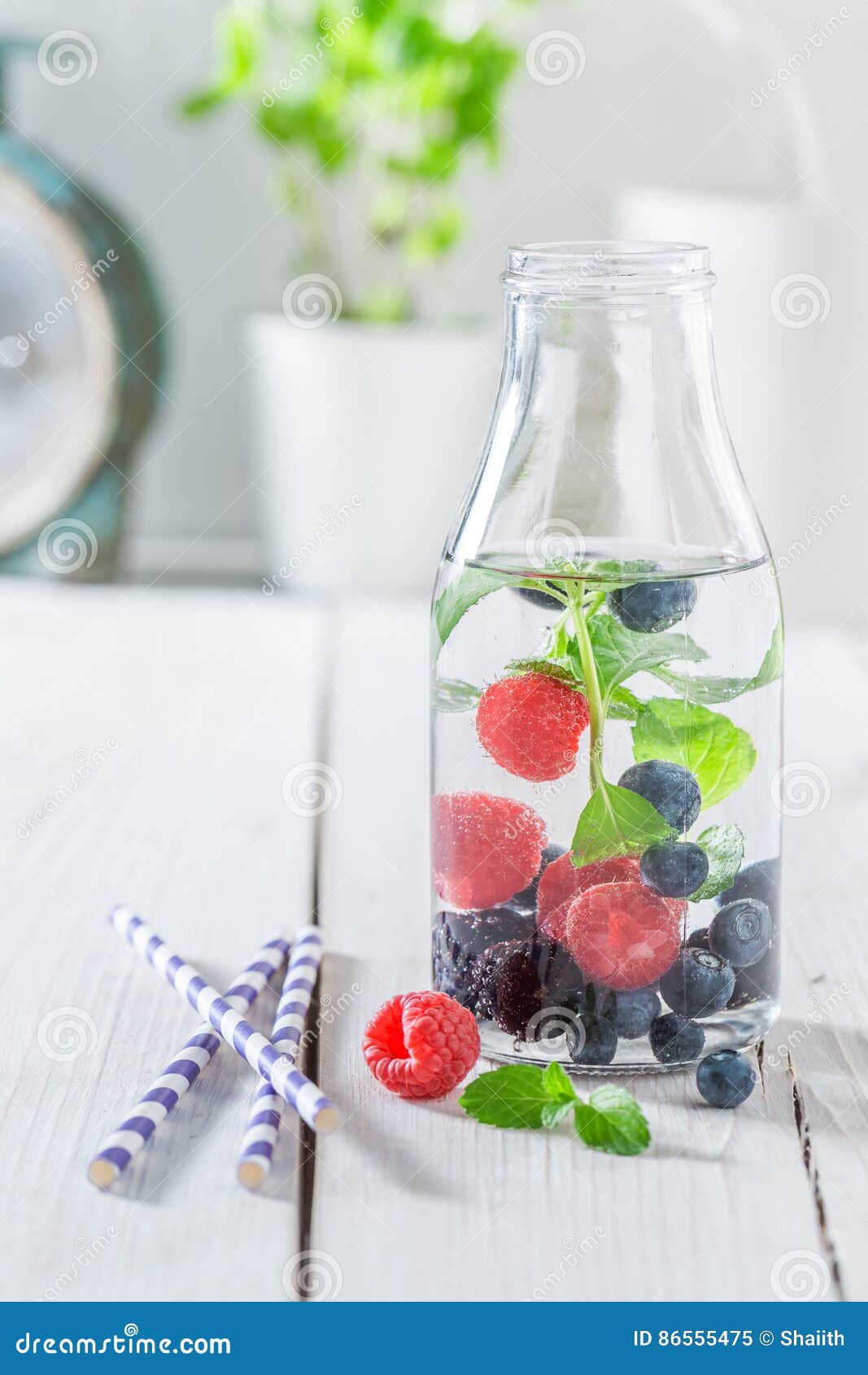 Fruity Soda in Bottle with Berries and Mint Leaves Stock Image - Image ...