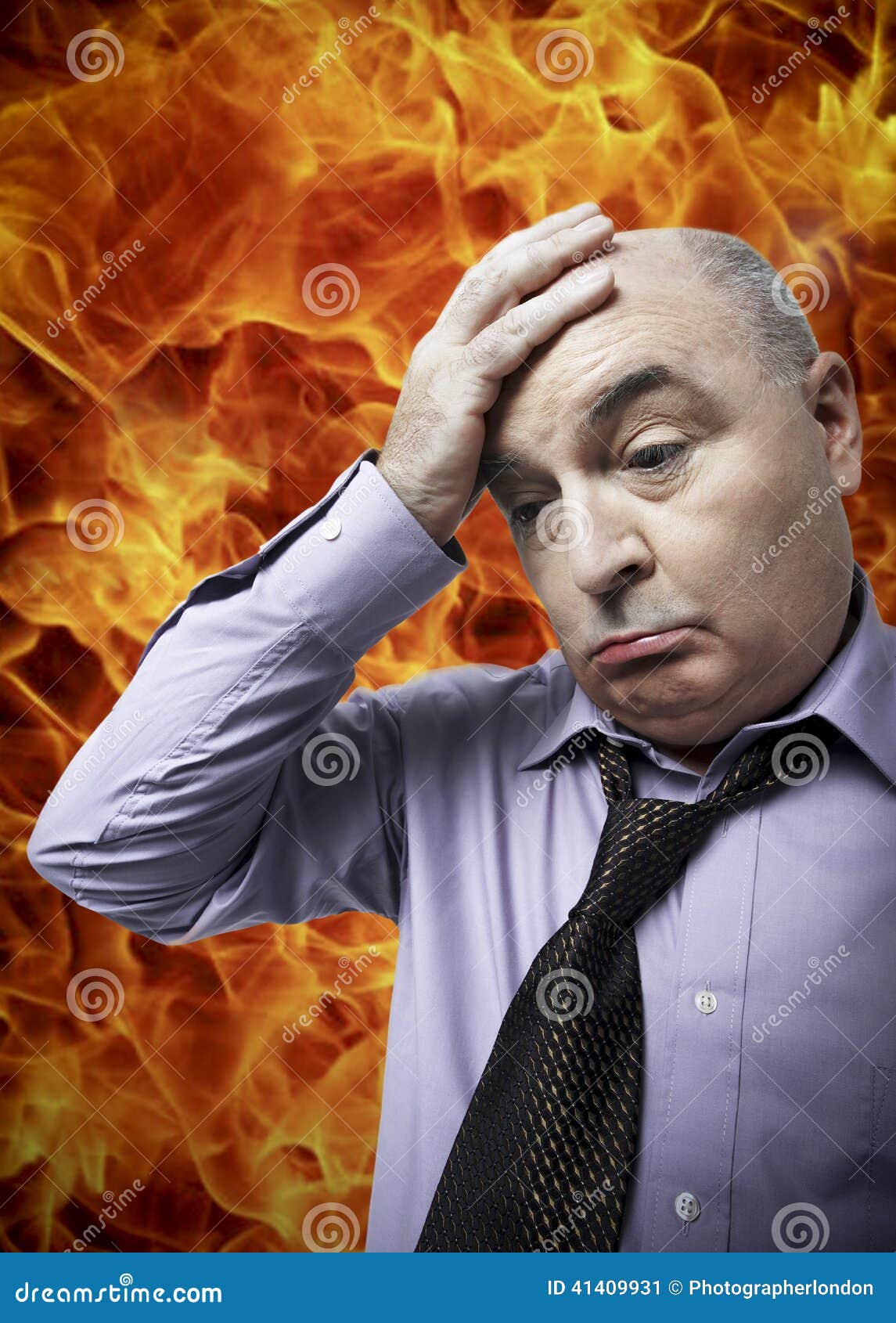 Frustrated Businessman with Hand on Head Standing Against Fire Stock ...