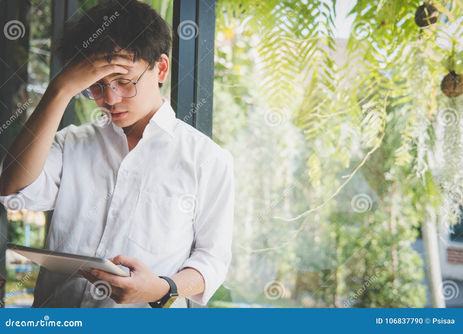 Frustrated Businessman Using Tablet Computer at Workplace. Start Stock ...
