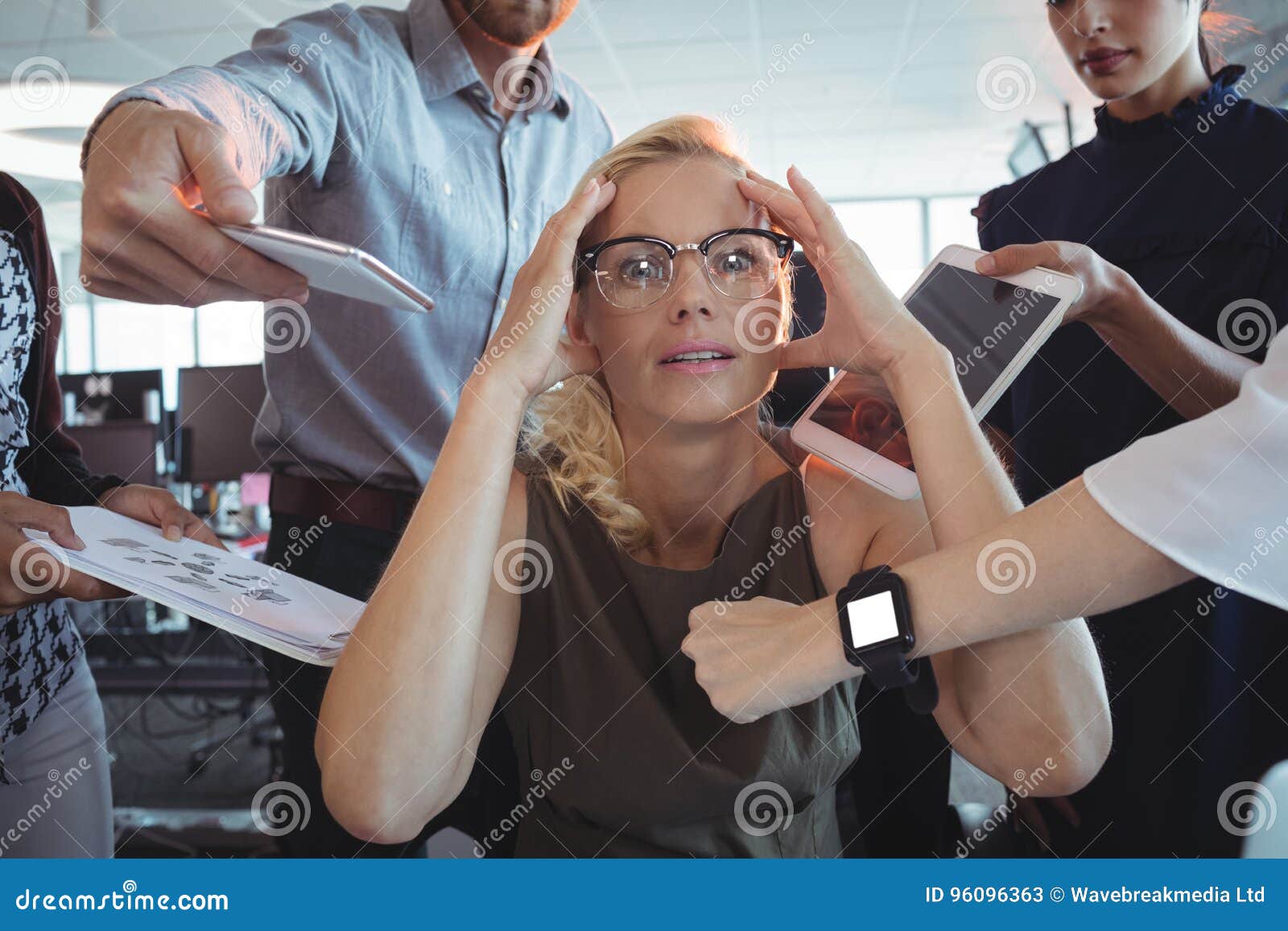 Frustrated Businesswoman Amidst Team Holding Technologies Stock Image ...