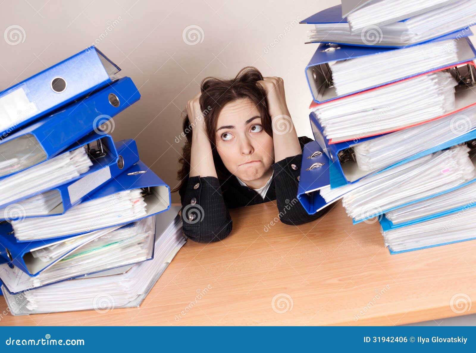 Frustrated Businesswoman with Stack of Folders at Office Stock Photo ...
