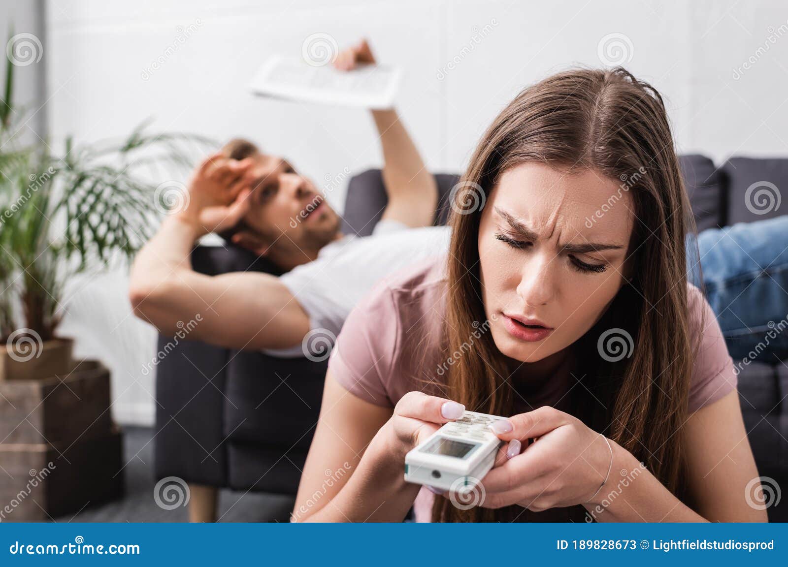 Frustrated Couple with Remote Controller and Stock Image - Image of ...