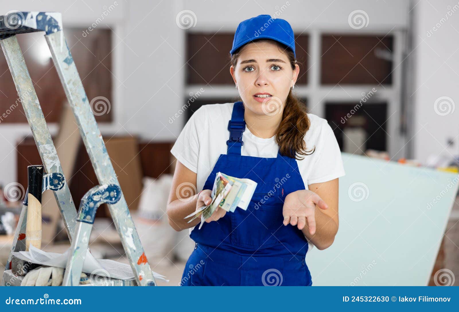 Frustrated Woman Builder is Unhappy with Earned Money Stock Photo ...