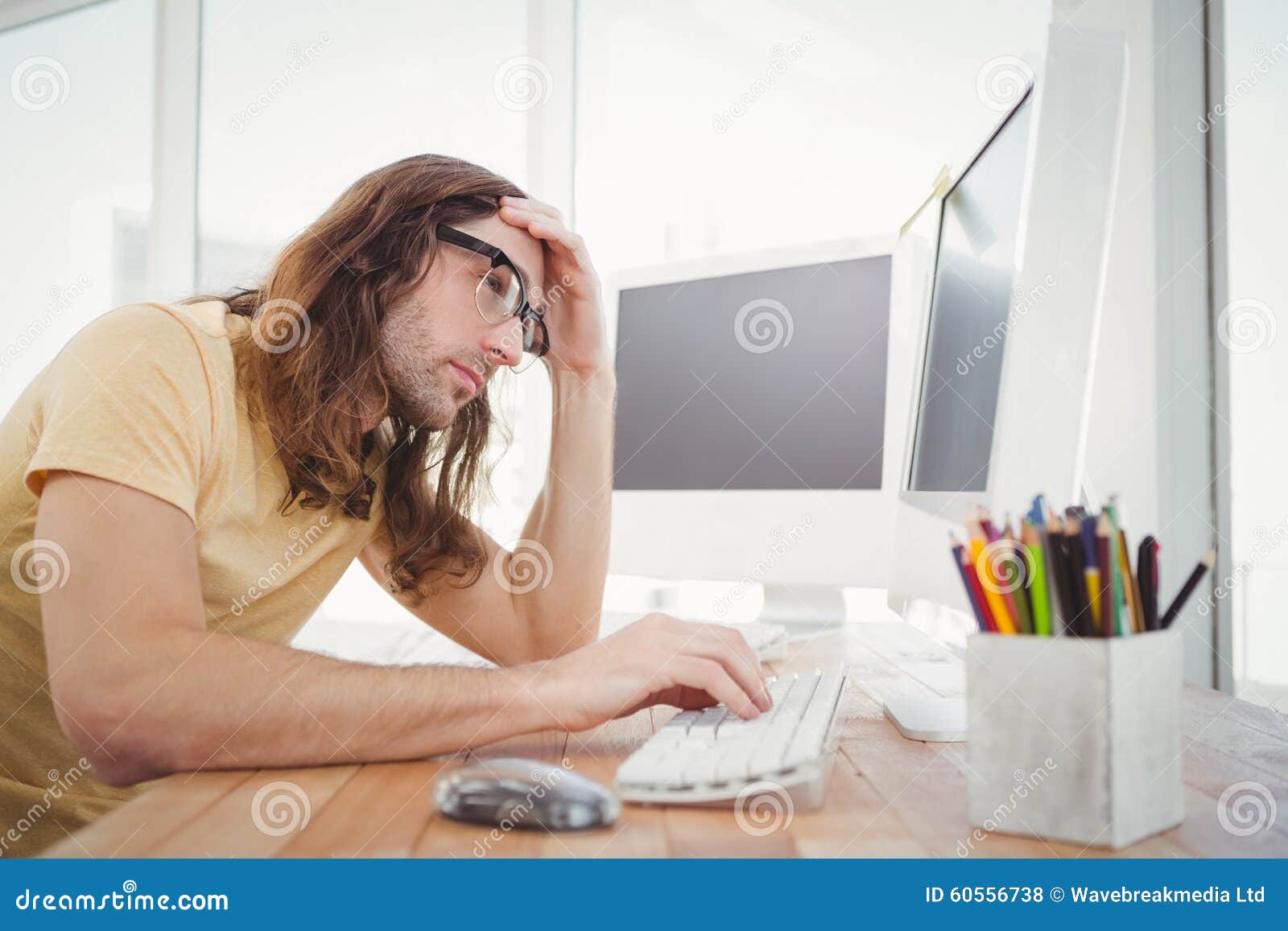 Frustrated Hipster Working on Computer Stock Photo - Image of office ...