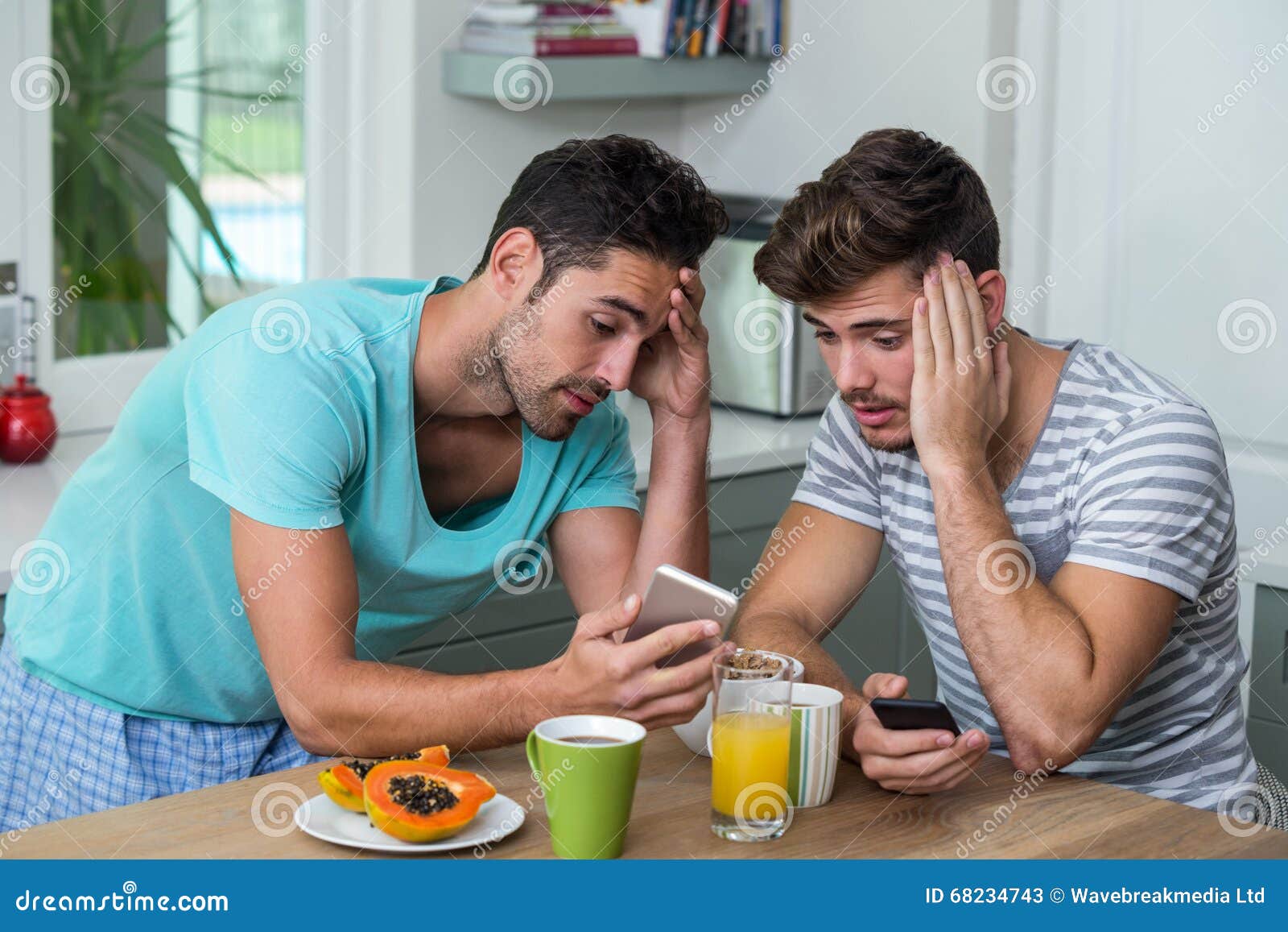 Frustrated Male Friends Using Phone Stock Image - Image of front ...