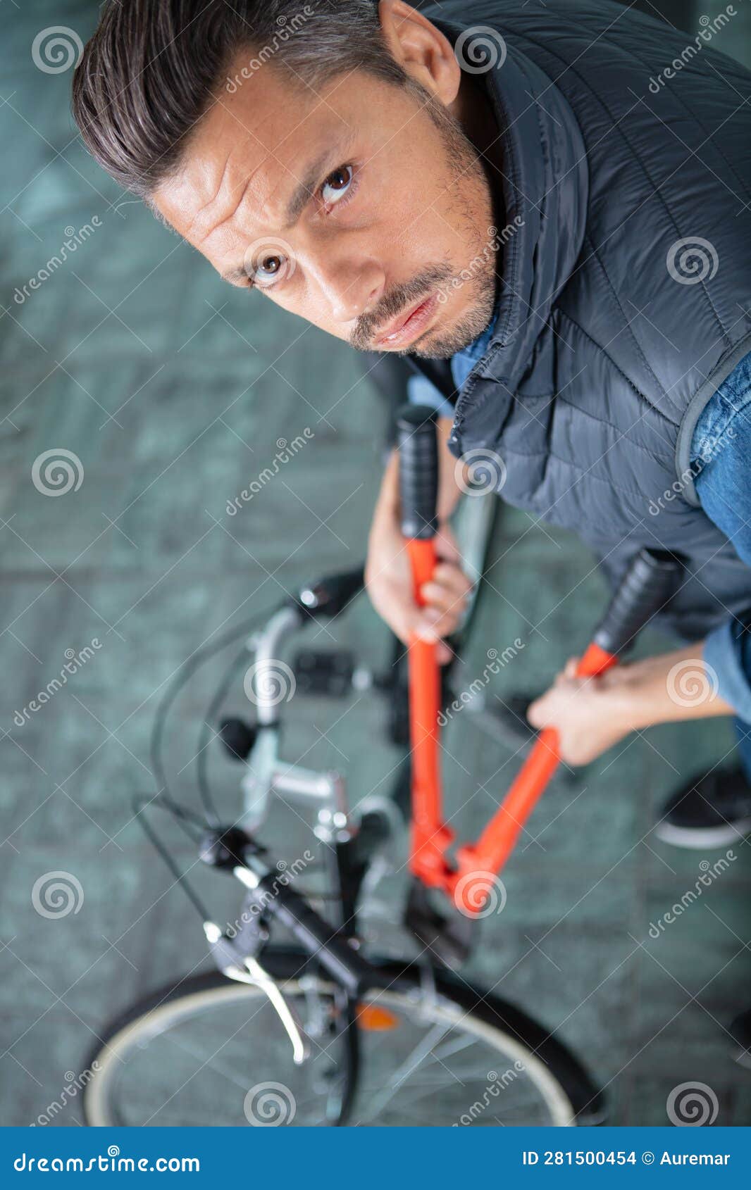 Frustrated Man Using Bolt Croppers on Bicycle Lock Stock Photo - Image ...