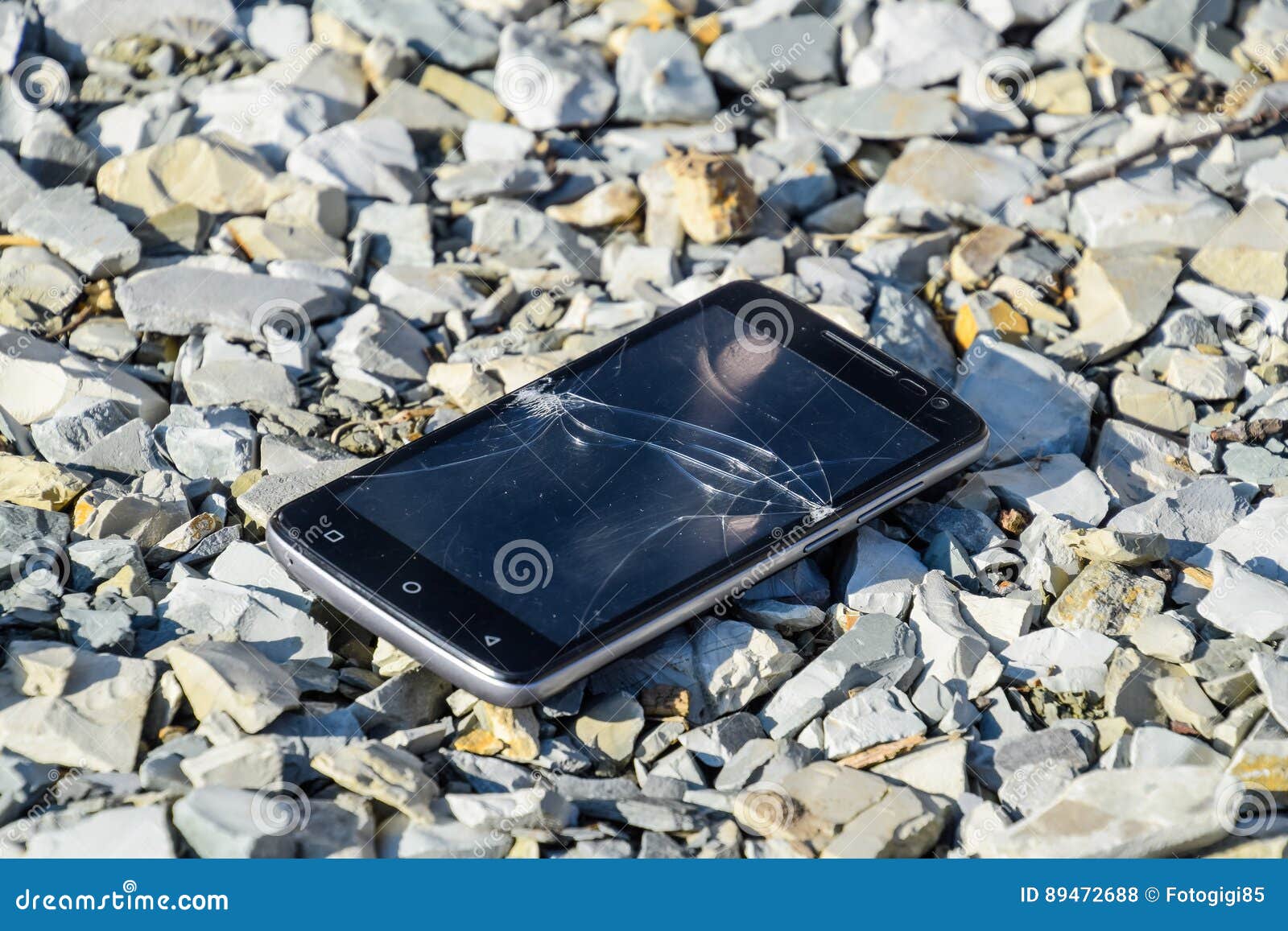 Frustrated Phone on the Rocks. Glass Shattered on Smartphone Stock ...