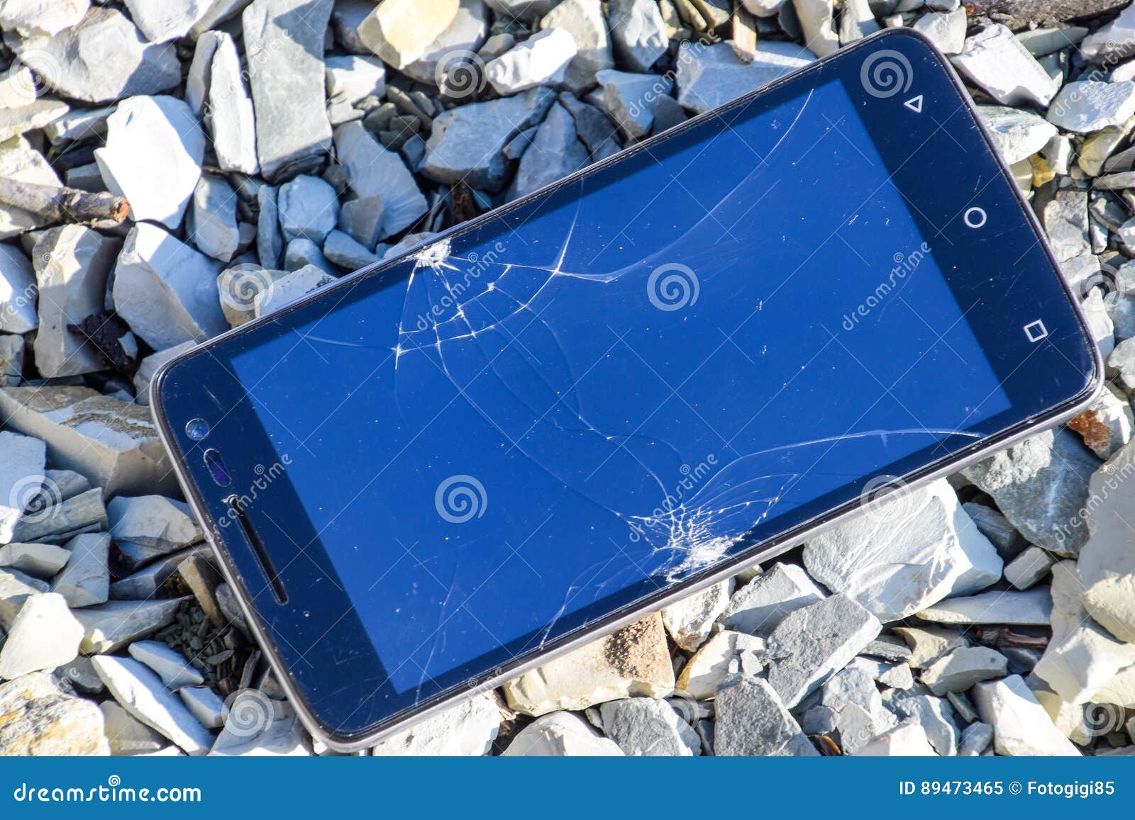 Frustrated Phone on the Rocks. Glass Shattered on Smartphone Stock ...
