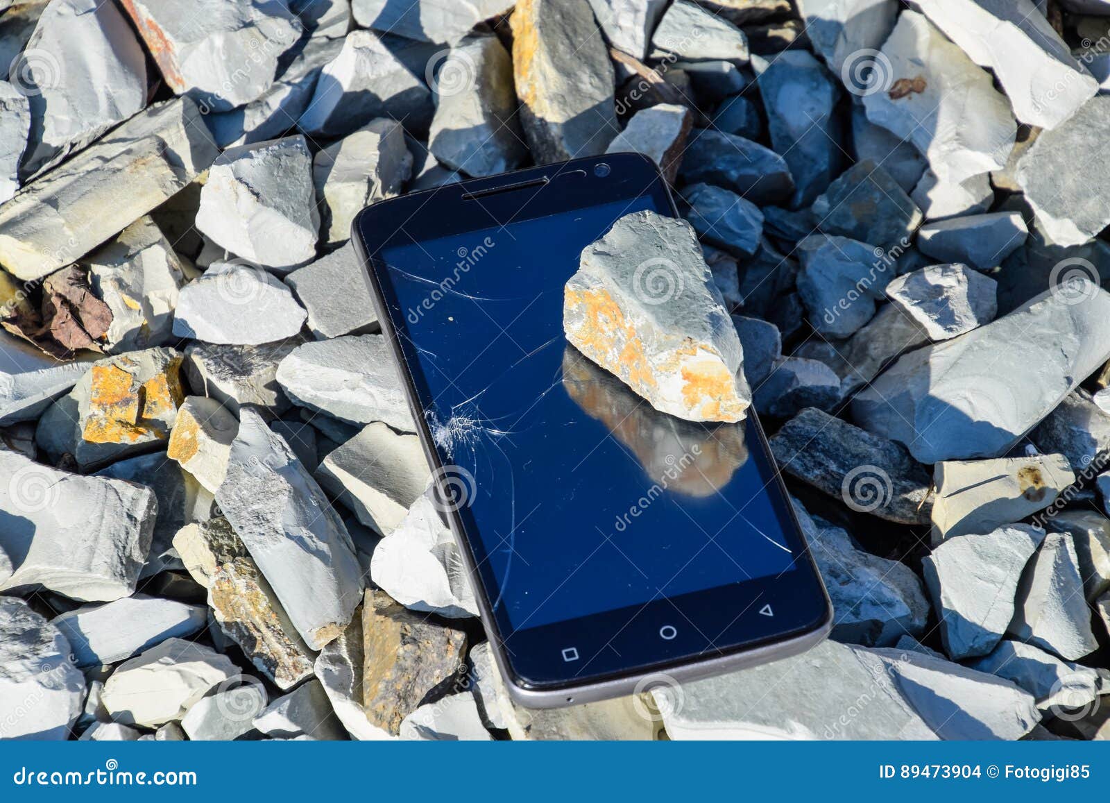Frustrated Phone on the Rocks. Glass Shattered on Smartphone Stock ...