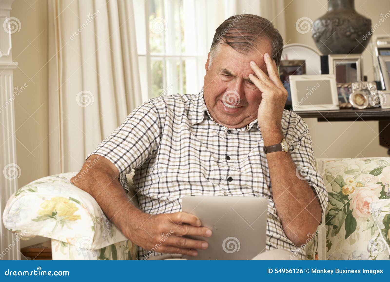 Frustrated Retired Senior Man Sitting on Sofa at Home Using Digital ...