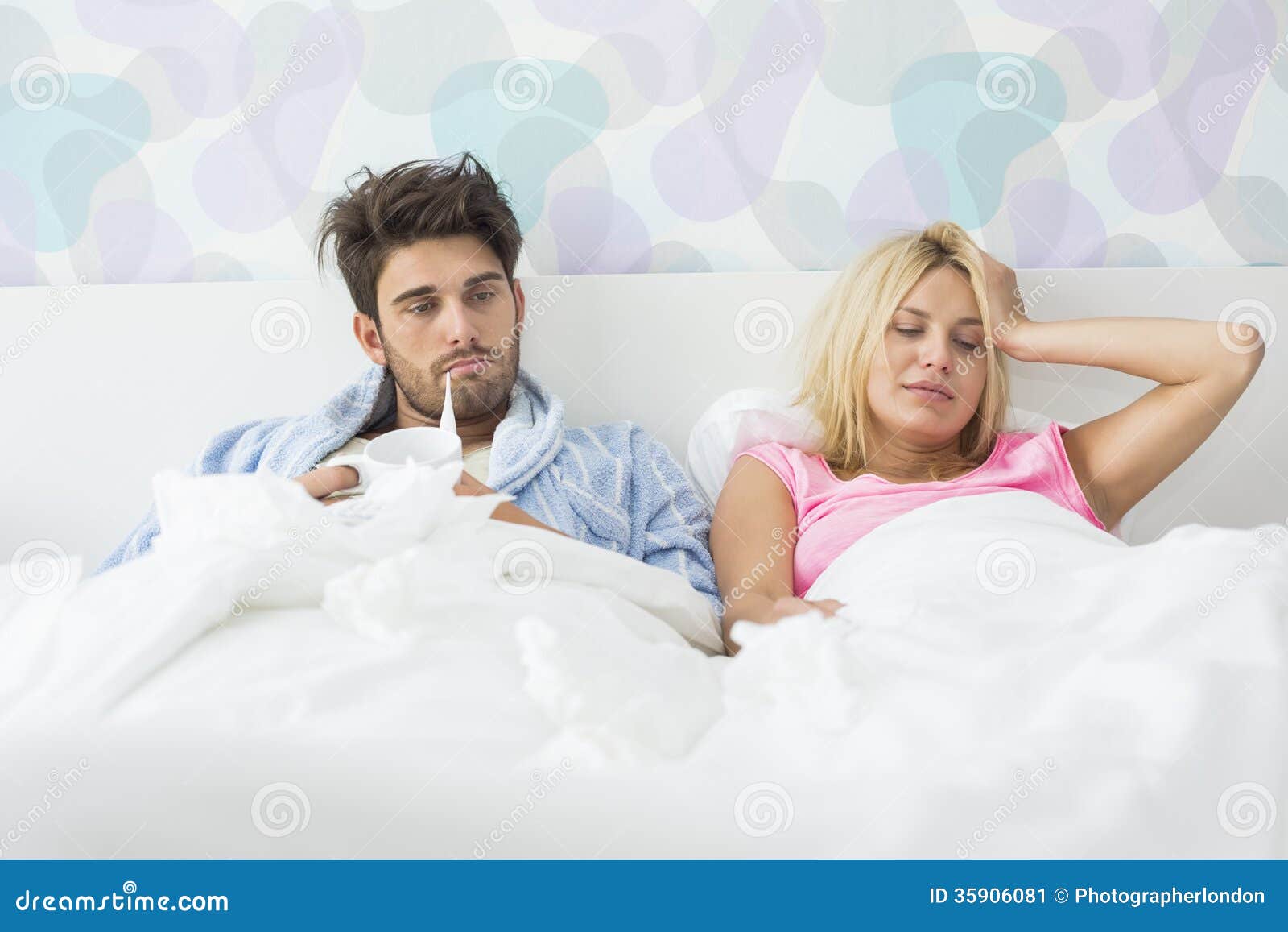 Frustrated Sick Couple Lying in Bed at Home Stock Image - Image of ...