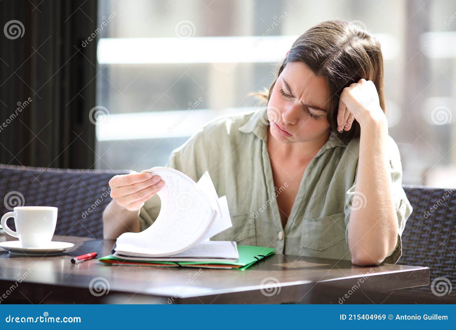 Frustrated Student Complaining Checking Notes in a Bar Stock Image ...