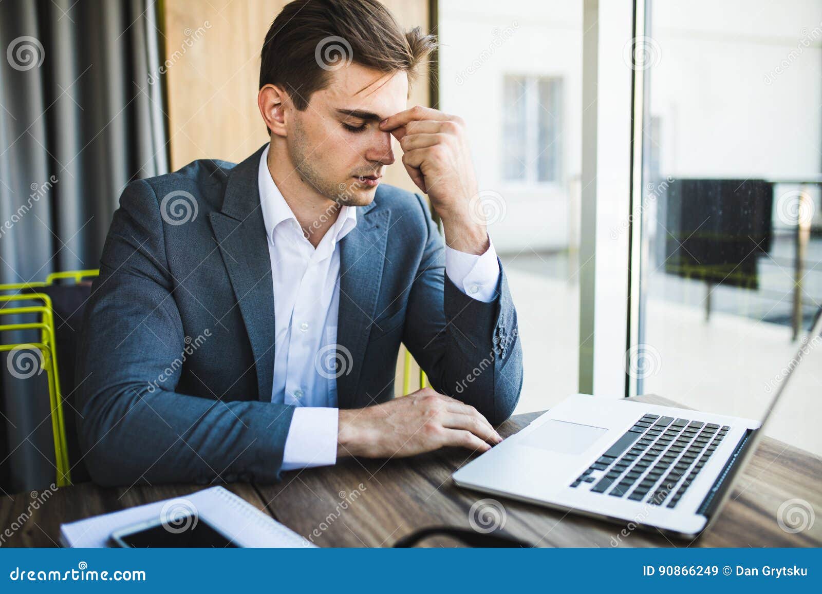 Frustrated Young Business Man Working on Laptop Computer at Office ...