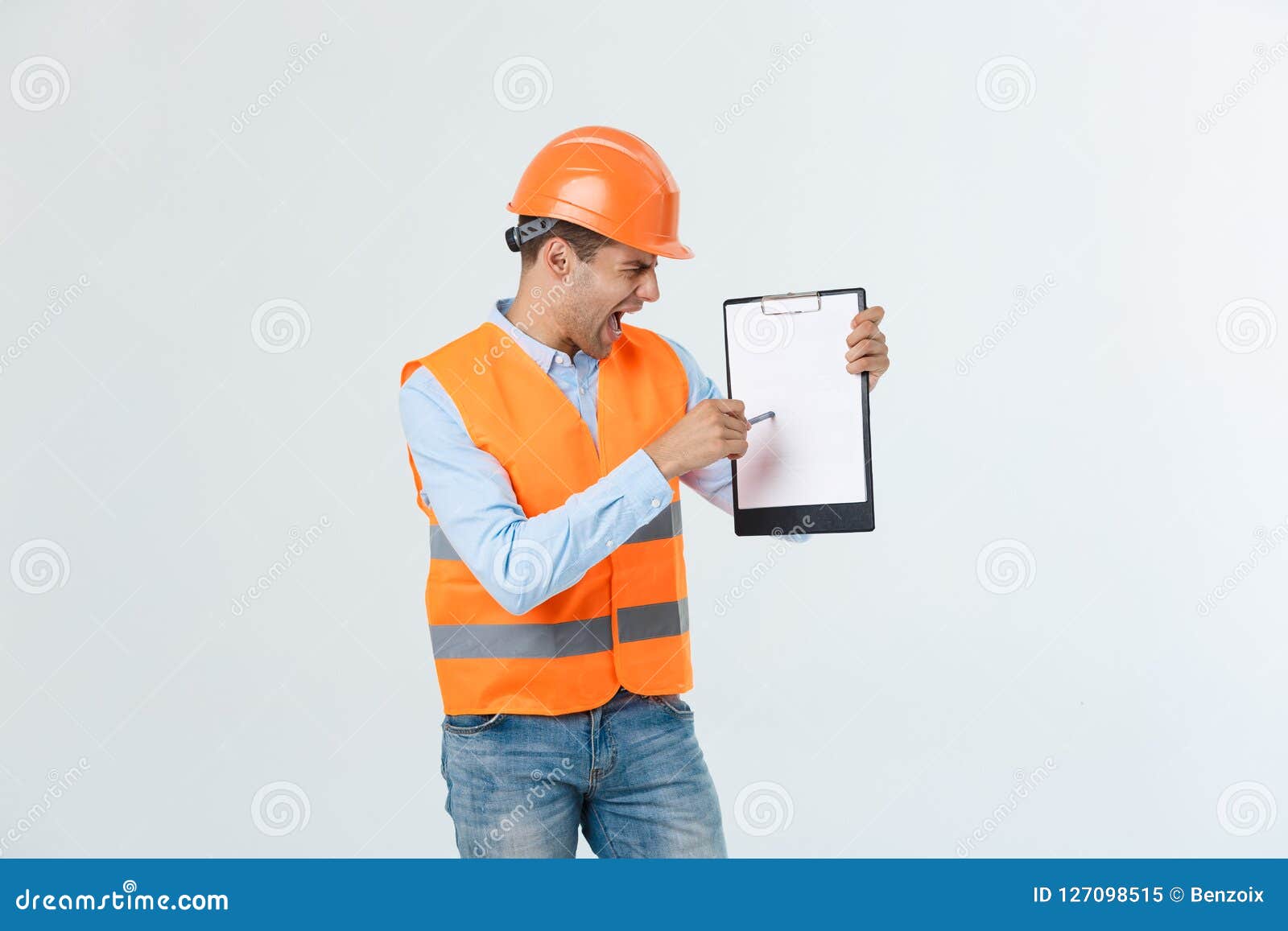 Frustrated Young Engineer with Hardhat and Reflective Vest Checking on ... Frustrated Young Engineer with Hardhat and Reflective Vest Checking on ...