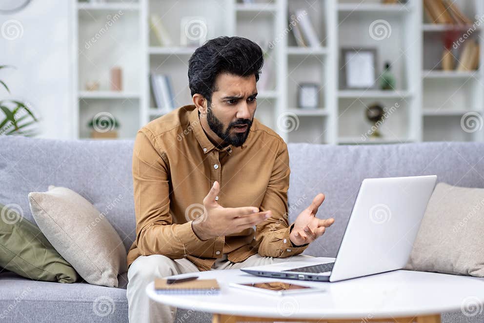 Frustrated Young Man with Beard Experiencing Computer Problems Working ...