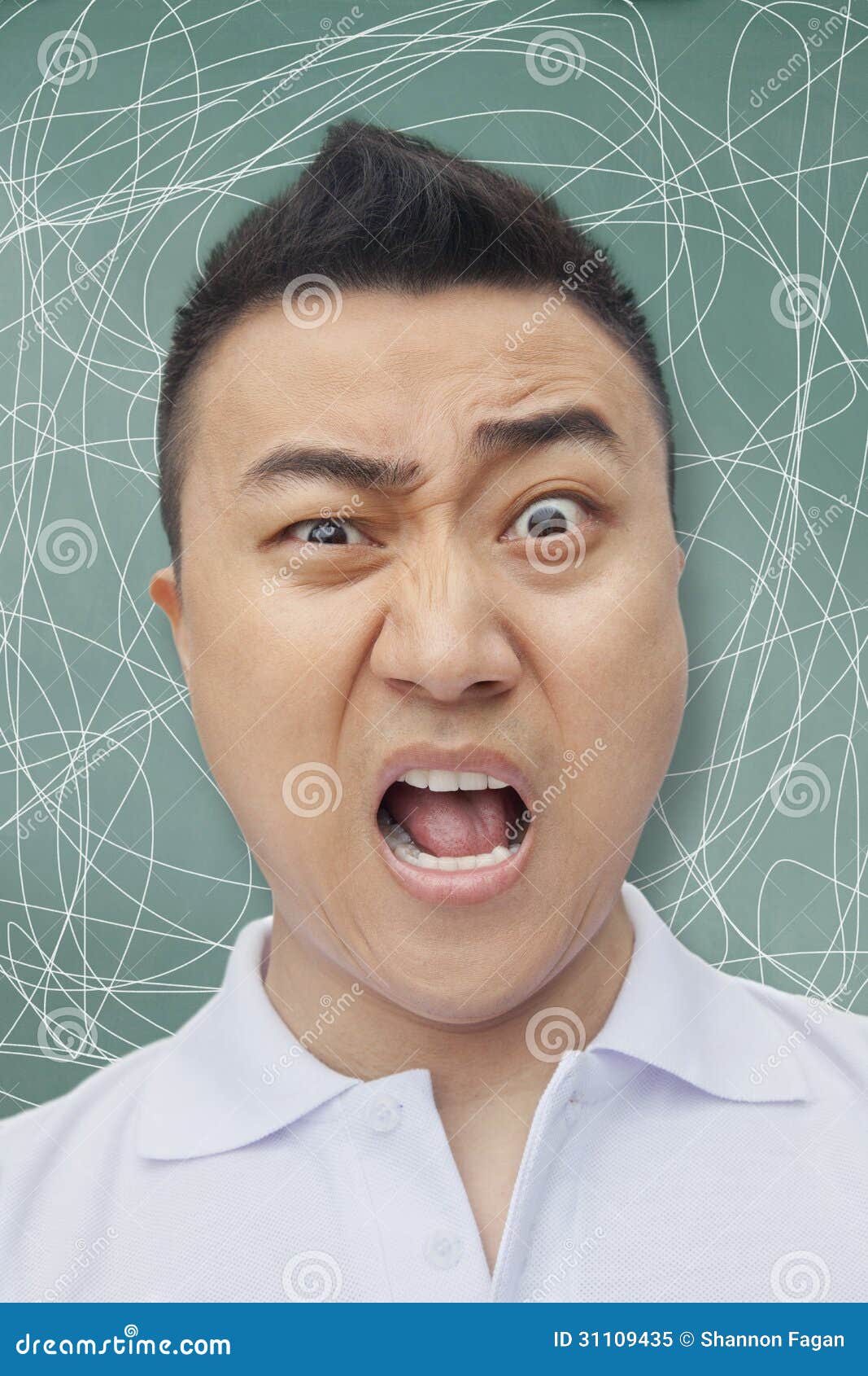 Frustrated Young Student In Front Of Blackboard, Making A Face Stock ...