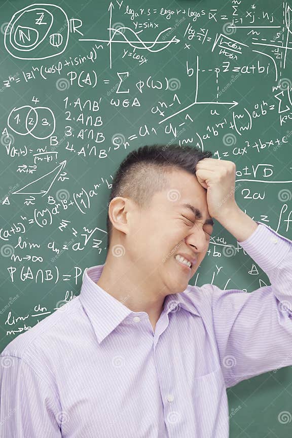 Frustrated Young Student in Front of Blackboard with Math Equations ...