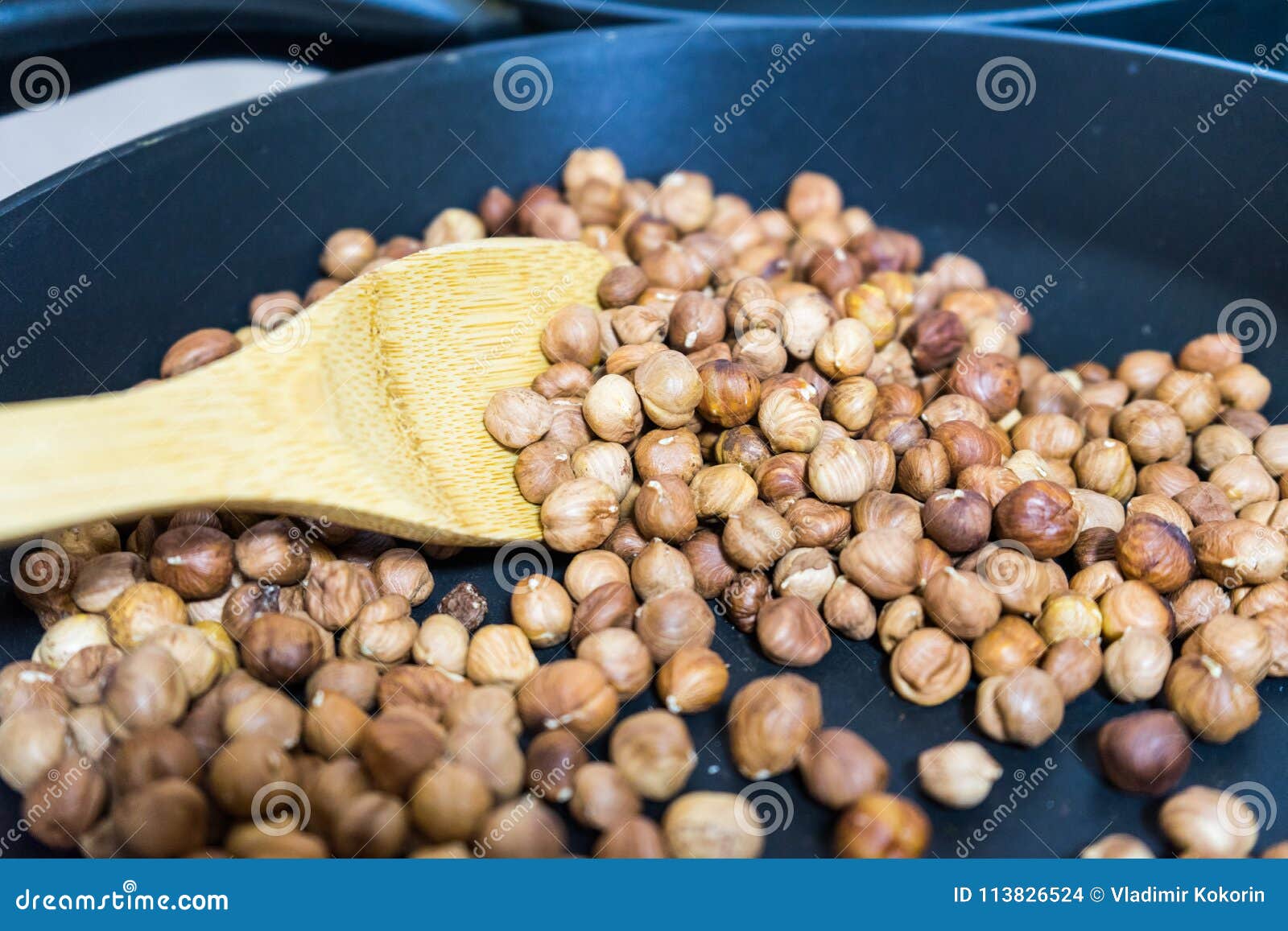 Fry Hazelnuts in a Frying Pan. Fresh Nuts in the Pan Stock Photo ...