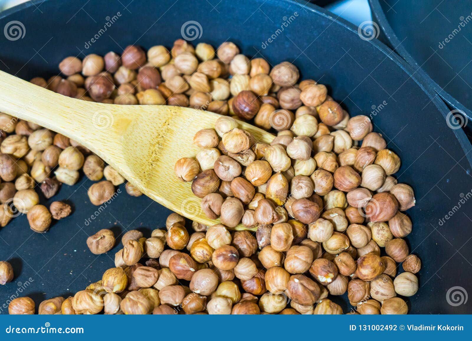 Fry Hazelnuts in a Frying Pan. Fresh Nuts in the Pan Stock Photo ...