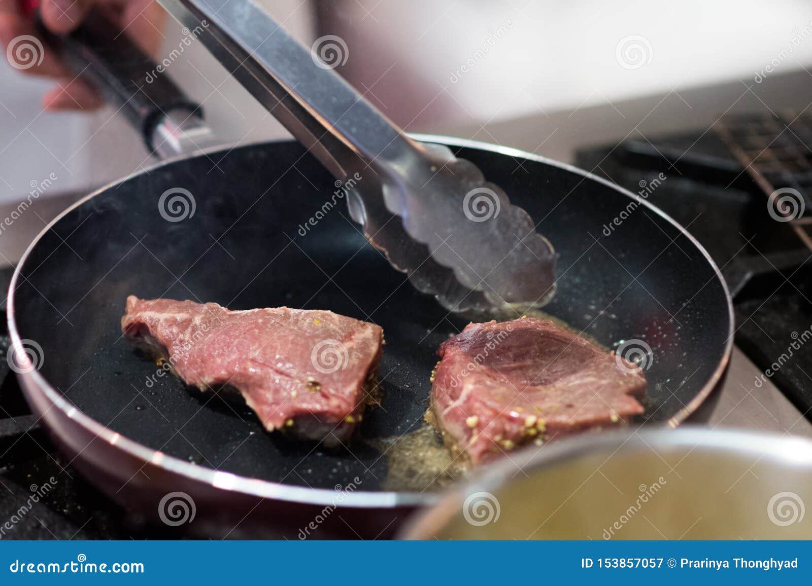 Fry the Meat in a Frying Pan. Chef Preparing and Spicing Meat ...