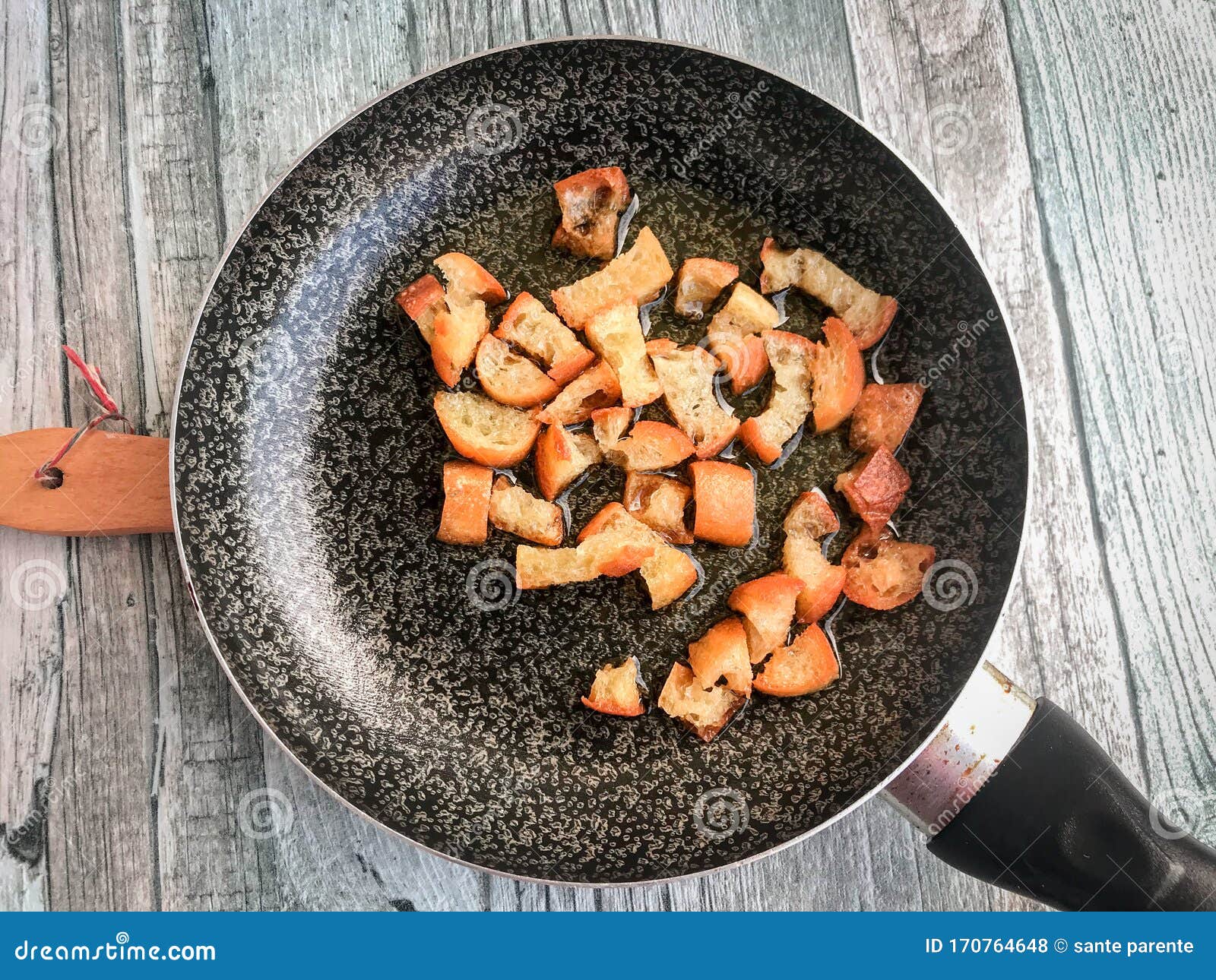 Frying Bread Chops for a Traditionbal Recipe in Puglia Stock Photo ...