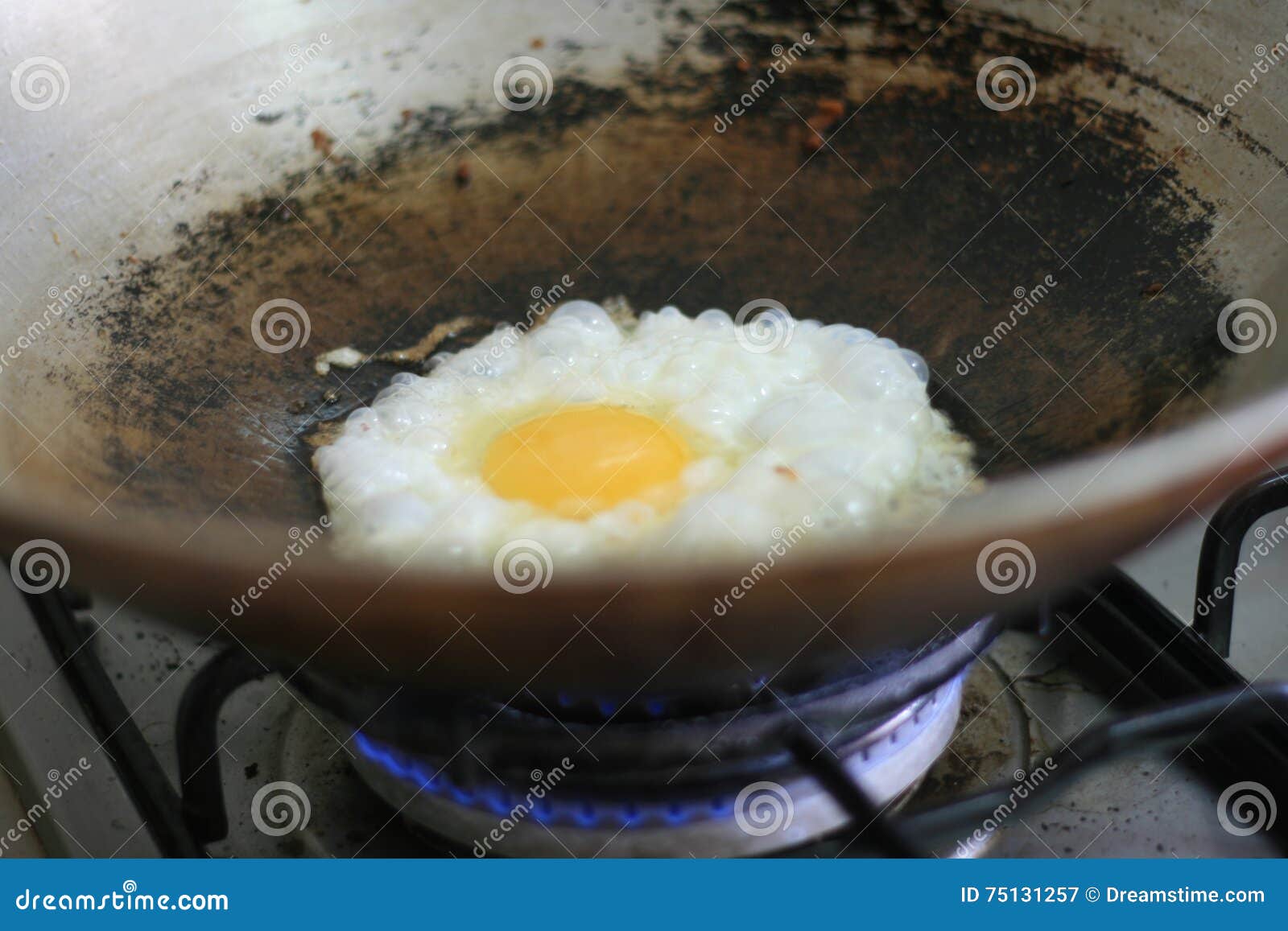 Frying an egg stock image. Image of food, frying, chinese - 75131257