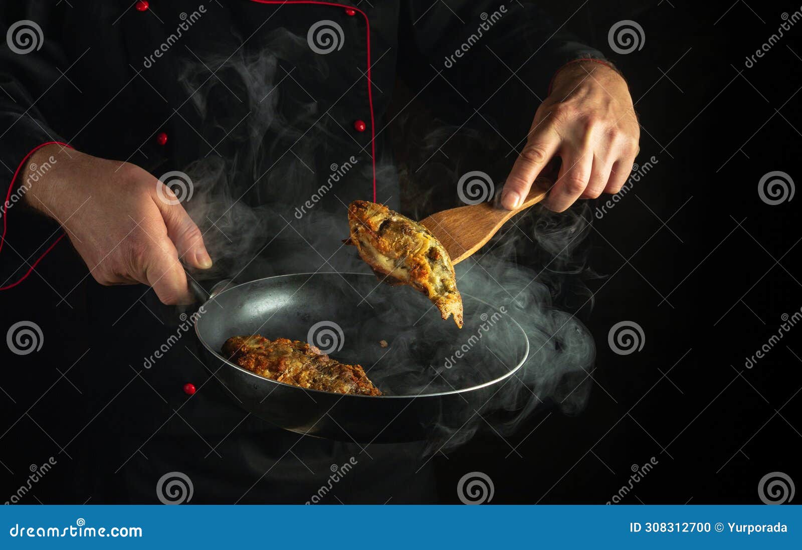 Frying Fish in a Frying Pan in the Hands of a Chef. Fish Diet Concept ...