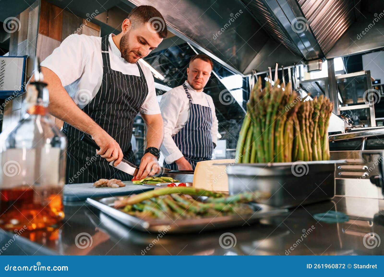 Frying the Meat. Kitchen Workers is Together Preparing the Food Stock ...