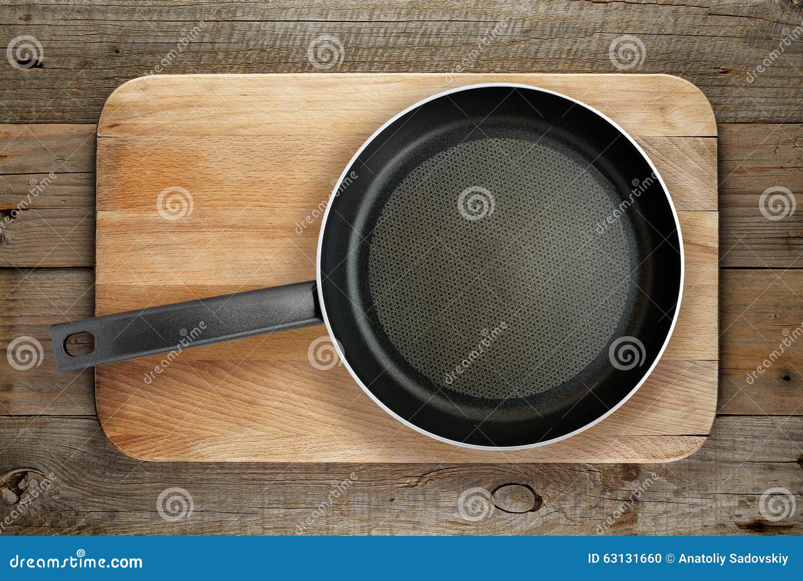 Frying Pan on Chopping Board Stock Photo - Image of table, wooden: 63131660