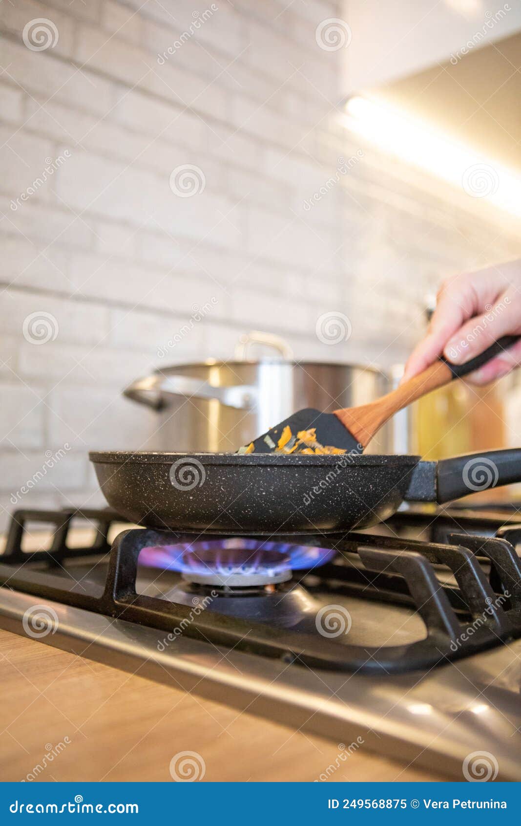 Frying Pan on Cooking Top Blue Flame Stock Image - Image of ...