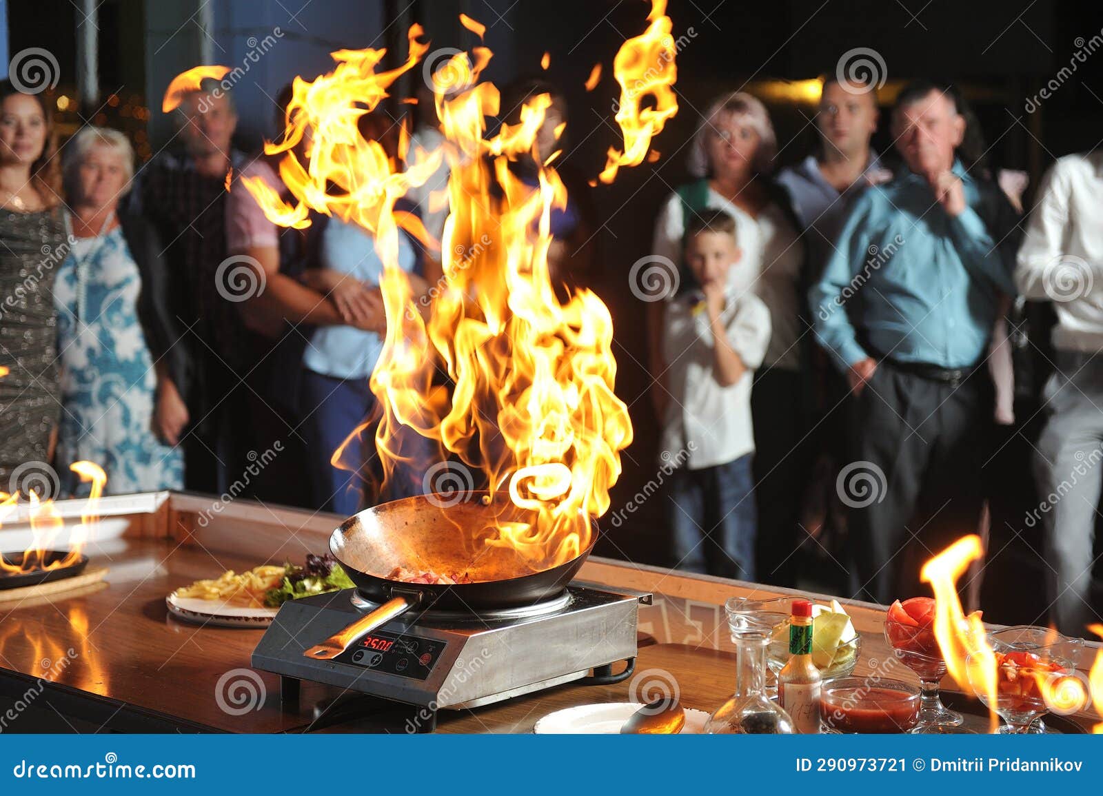 Frying Pan with Fire at a Cooking Show for People in a Restaurant Stock ...