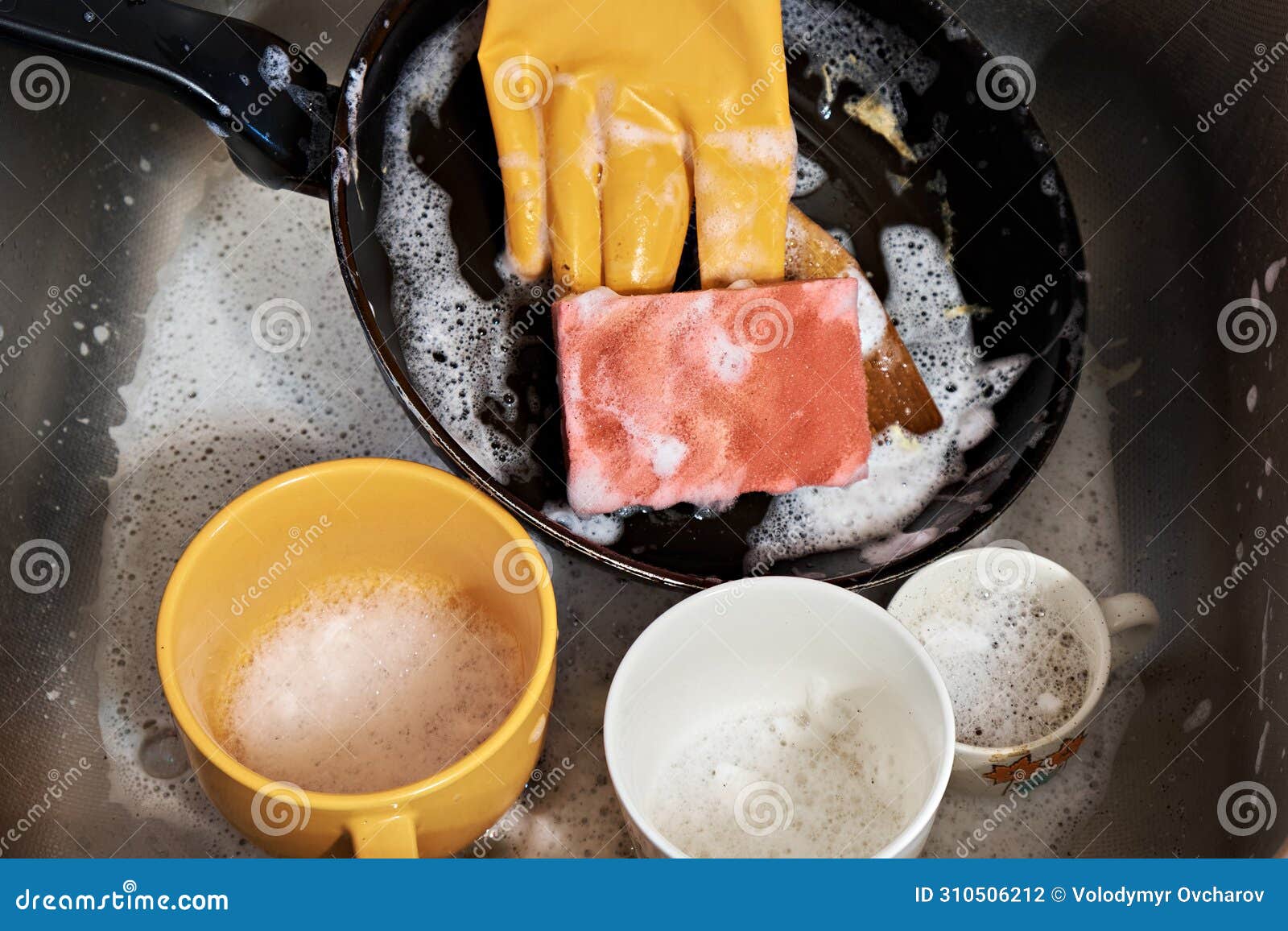 Frying Pan in Foam with Cleaning Sponge in Sink, Close-up Stock Photo ...