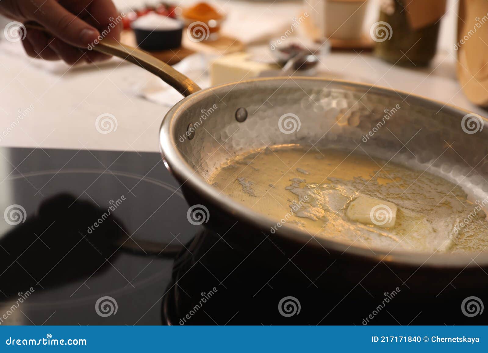 Frying Pan with Melted Butter on Stove, Closeup Stock Photo - Image of ...
