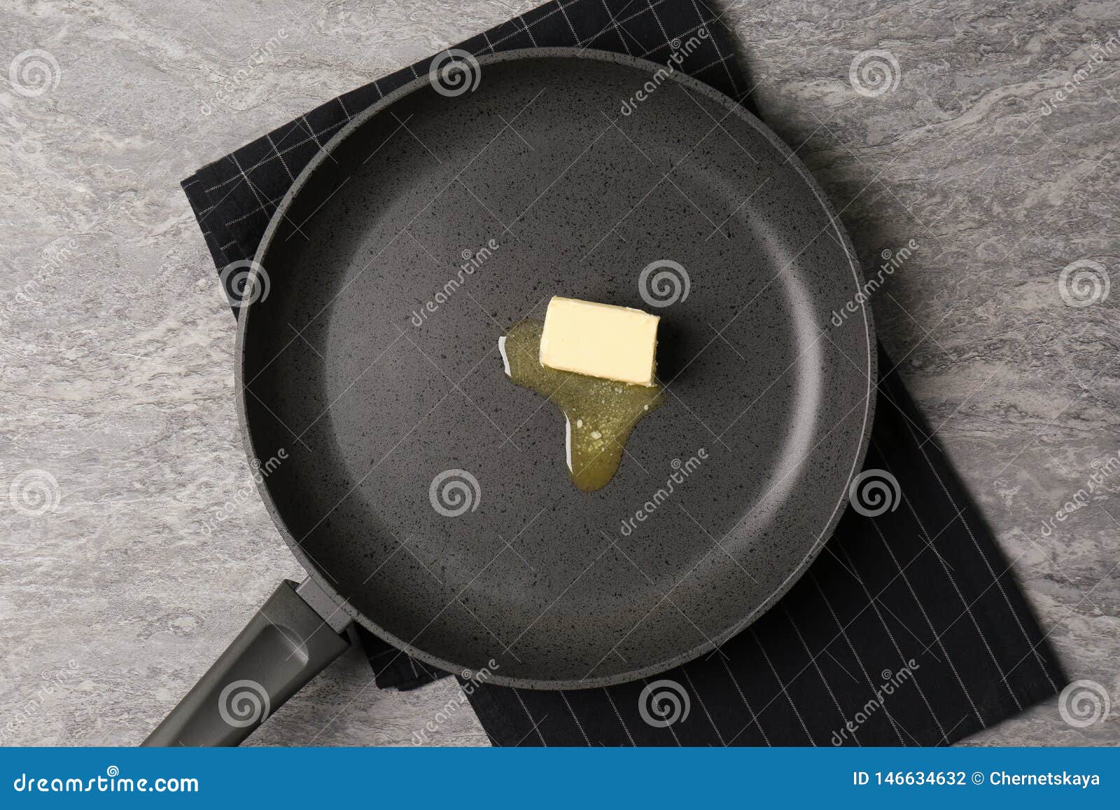 Frying Pan with Melting Butter on Grey Table Stock Photo - Image of ...