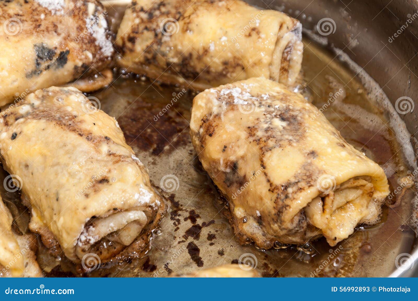 Frying Rolled Stuffed Pancakes in Hot Oil Stock Image - Image of ...