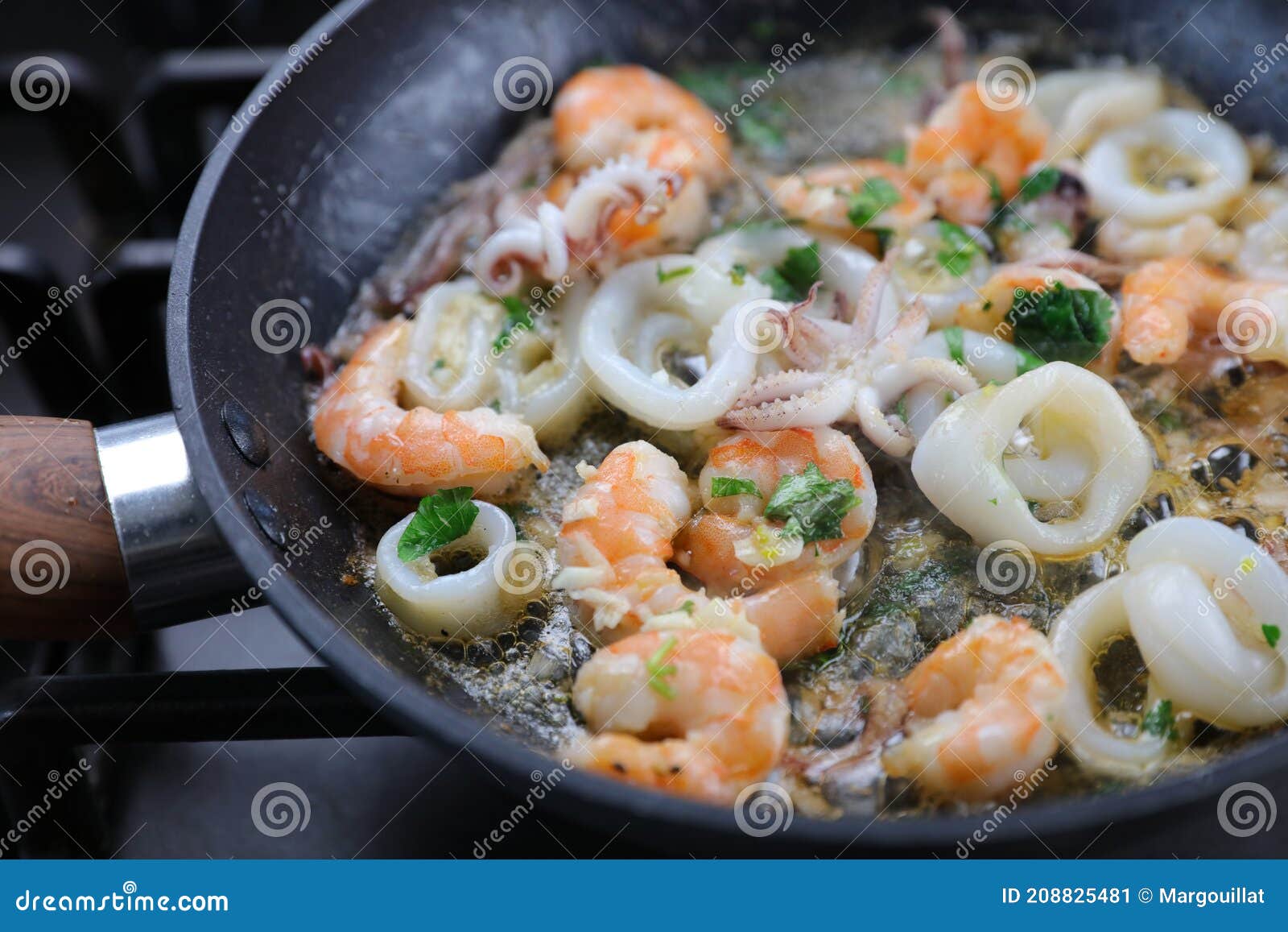 Frying Pan With Seafood In Batter Served With Sweet And Sour Sauce Is ...