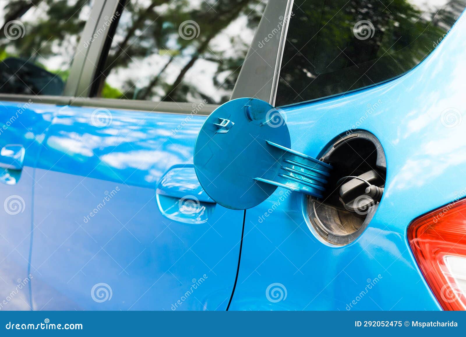 Fuel tank of a blue car stock image. Image of background - 292052475