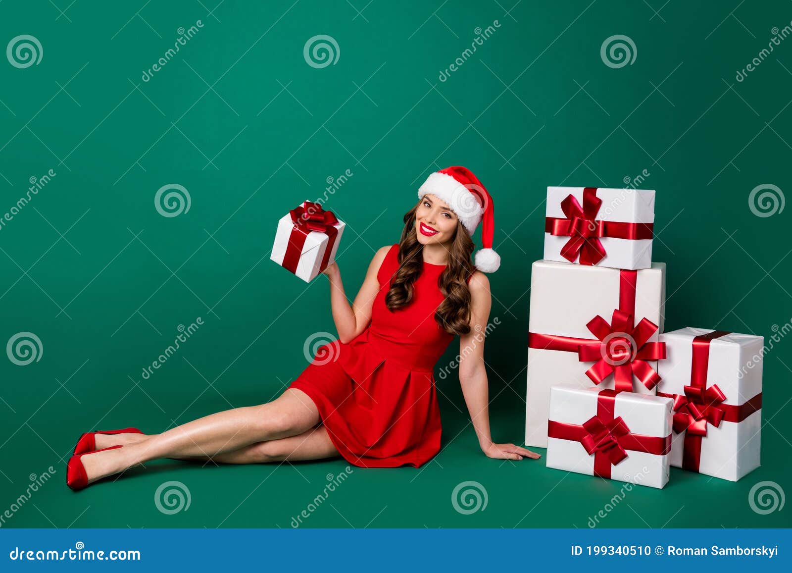 Full Body Photo Sweet Cute Nice Dreamy Girl In Santa Claus Headwear Sit