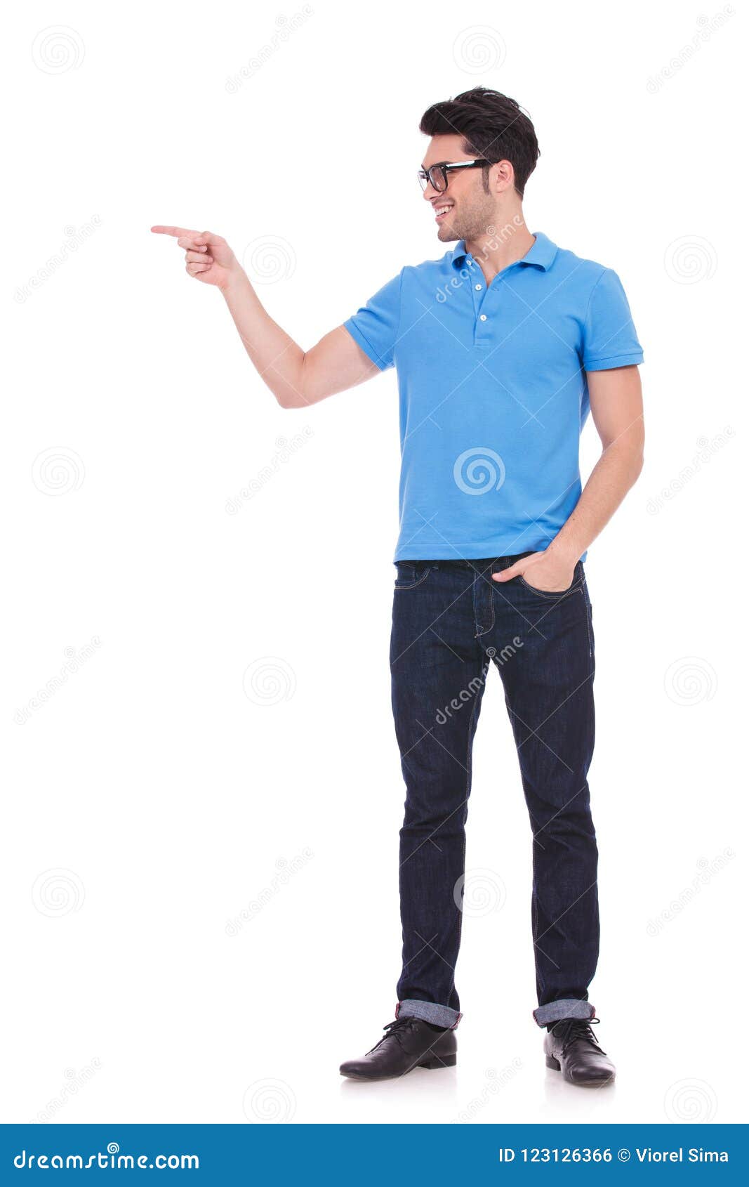 Full Body Picture of a Smiling Casual Man Pointing To Side Stock Photo ... Full Body Picture of a Smiling Casual Man Pointing To Side Stock Photo ...