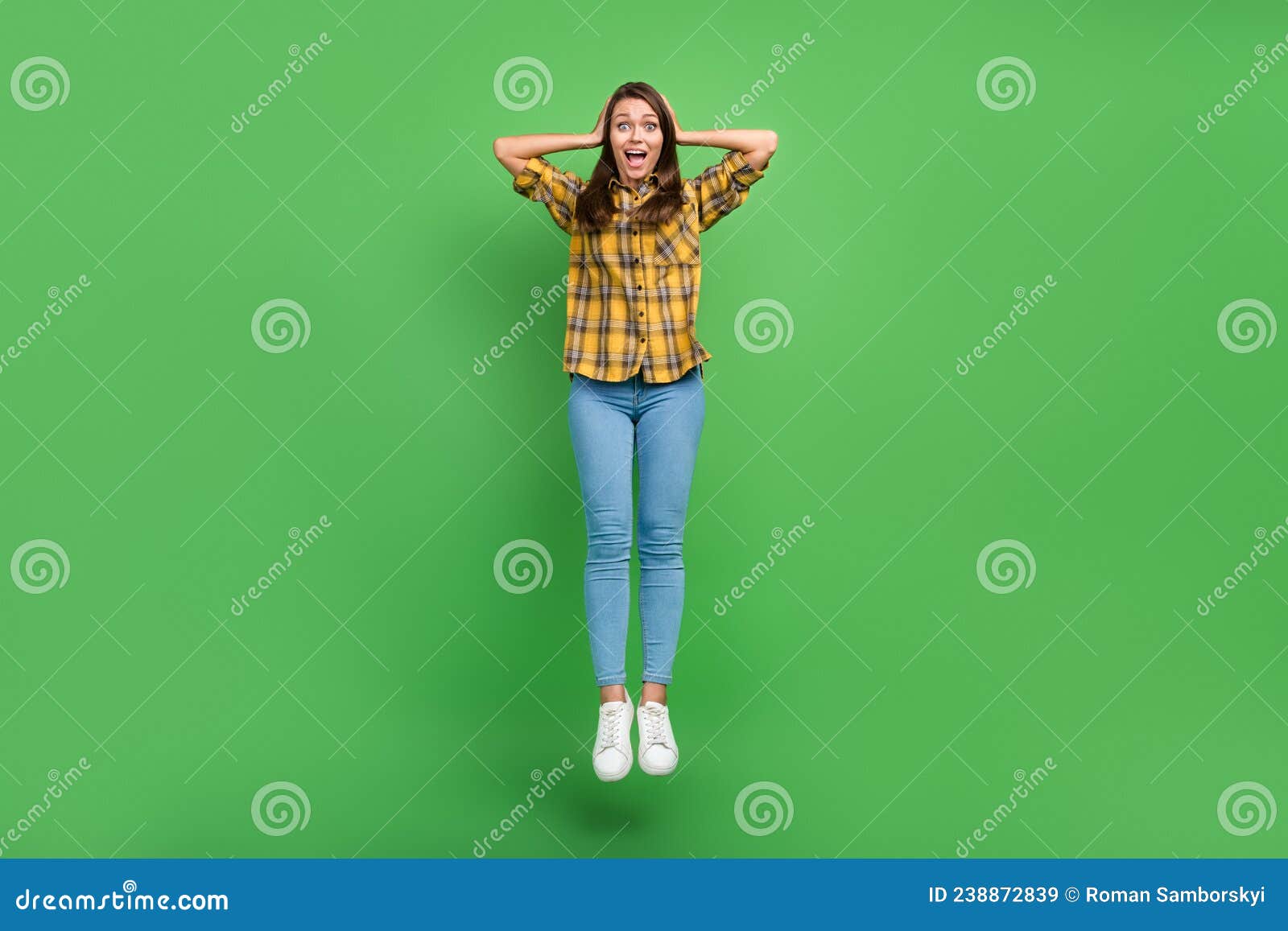 Full Body Portrait Of Astonished Impressed Girl Arms On Head Open Mouth