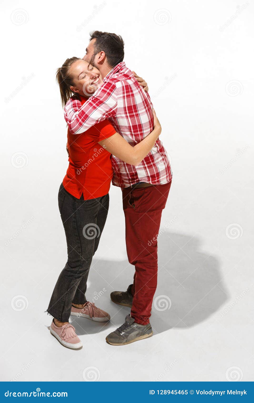 Full Body Portrait Of Hugging Couple With Smile Caucasian Models In